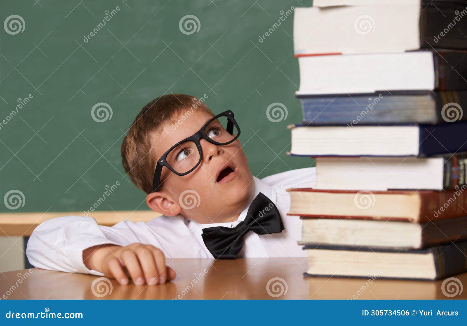 Child, Surprise and Stack of Books in Classroom for Education, Language ...