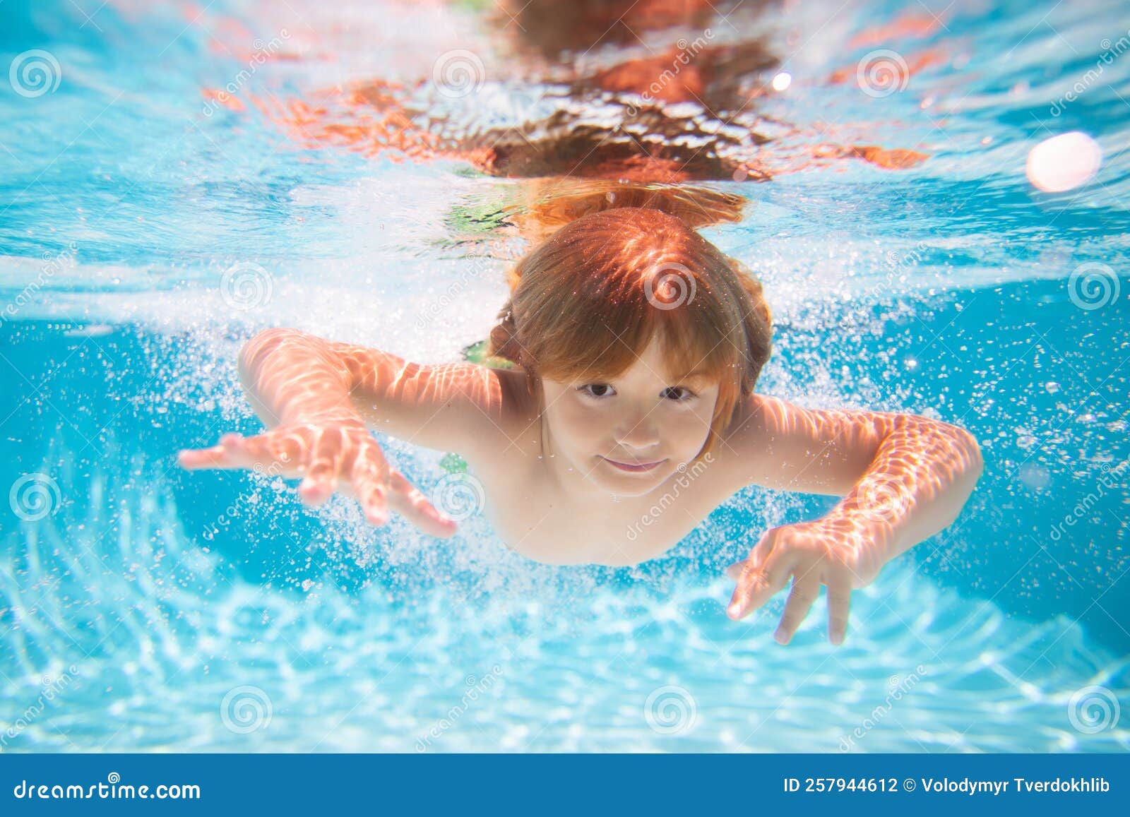 Child Swim and Dive Underwater in the Swimming Pool. Stock Photo ...