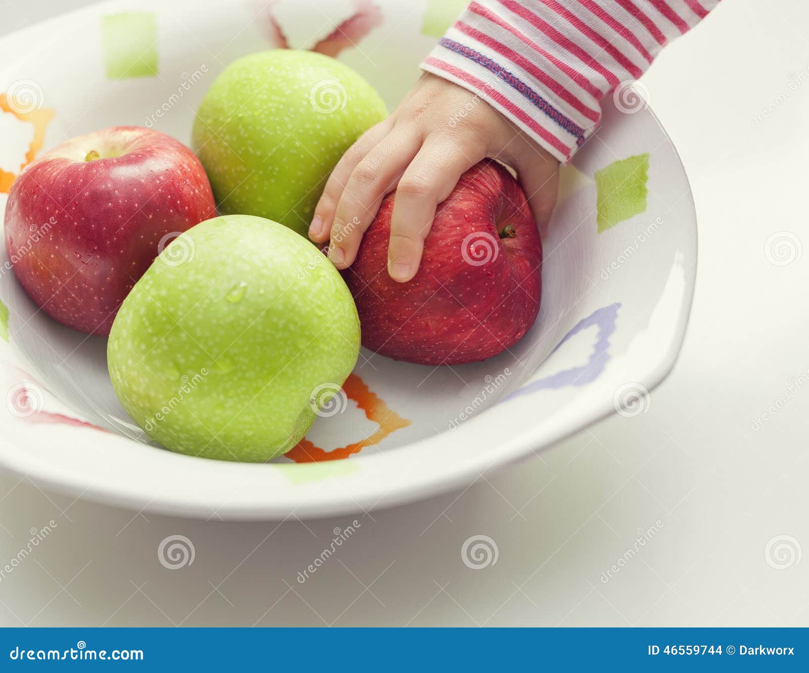 Child Taking Apple from Bowl Stock Photo - Image of apple, food: 46559744