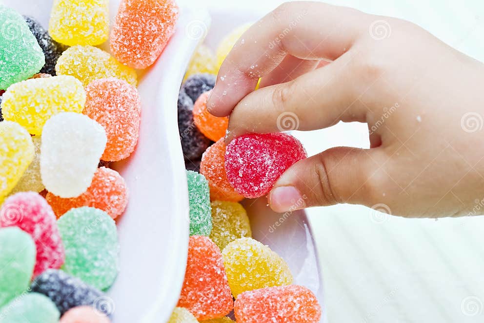 Child Taking Candy stock photo. Image of small, holiday - 10586014
