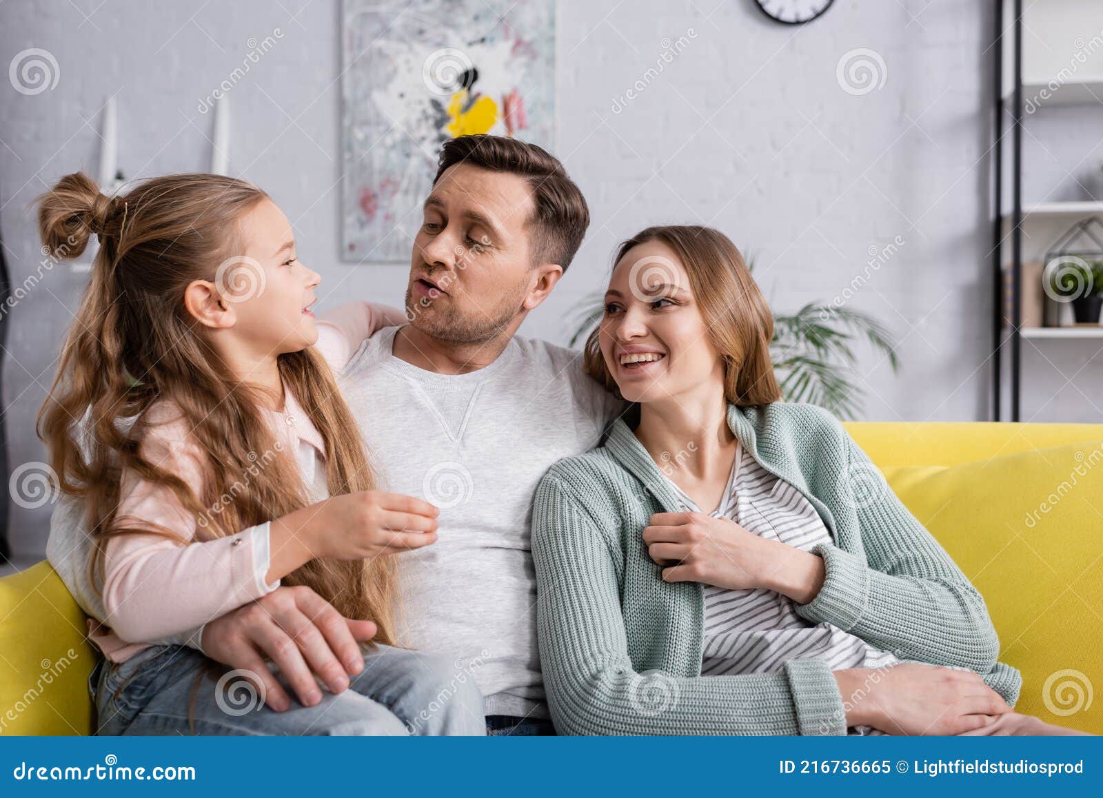 Child Talking To Smiling Parents on Stock Image - Image of parenthood ...