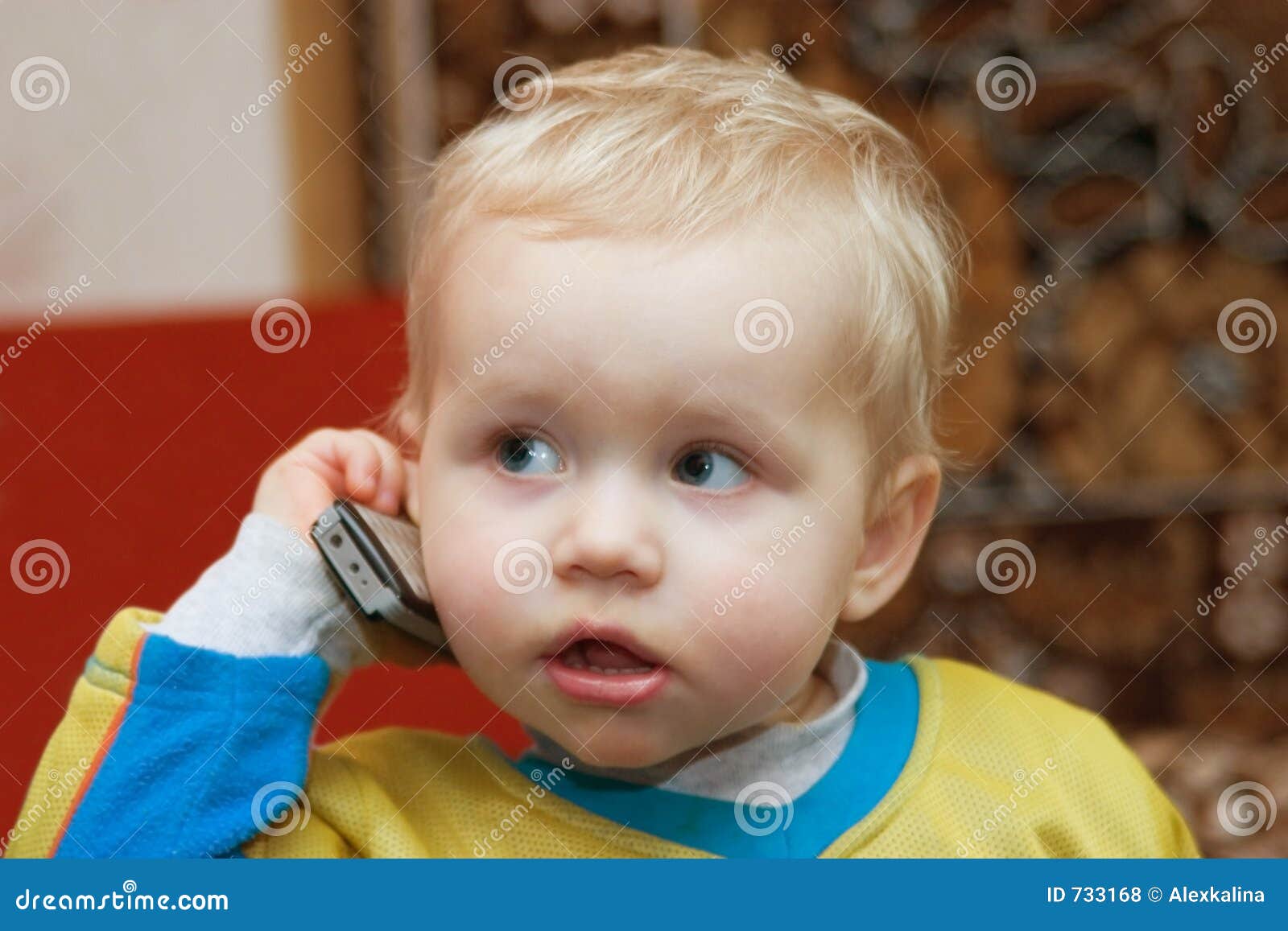 Child with a telephone stock photo. Image of look, listen - 733168
