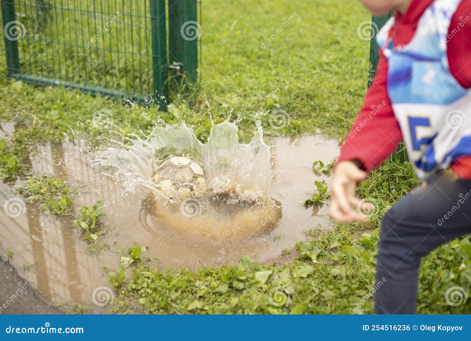 Child Threw Ball into Puddle. Hit Water Stock Photo - Image of color ...