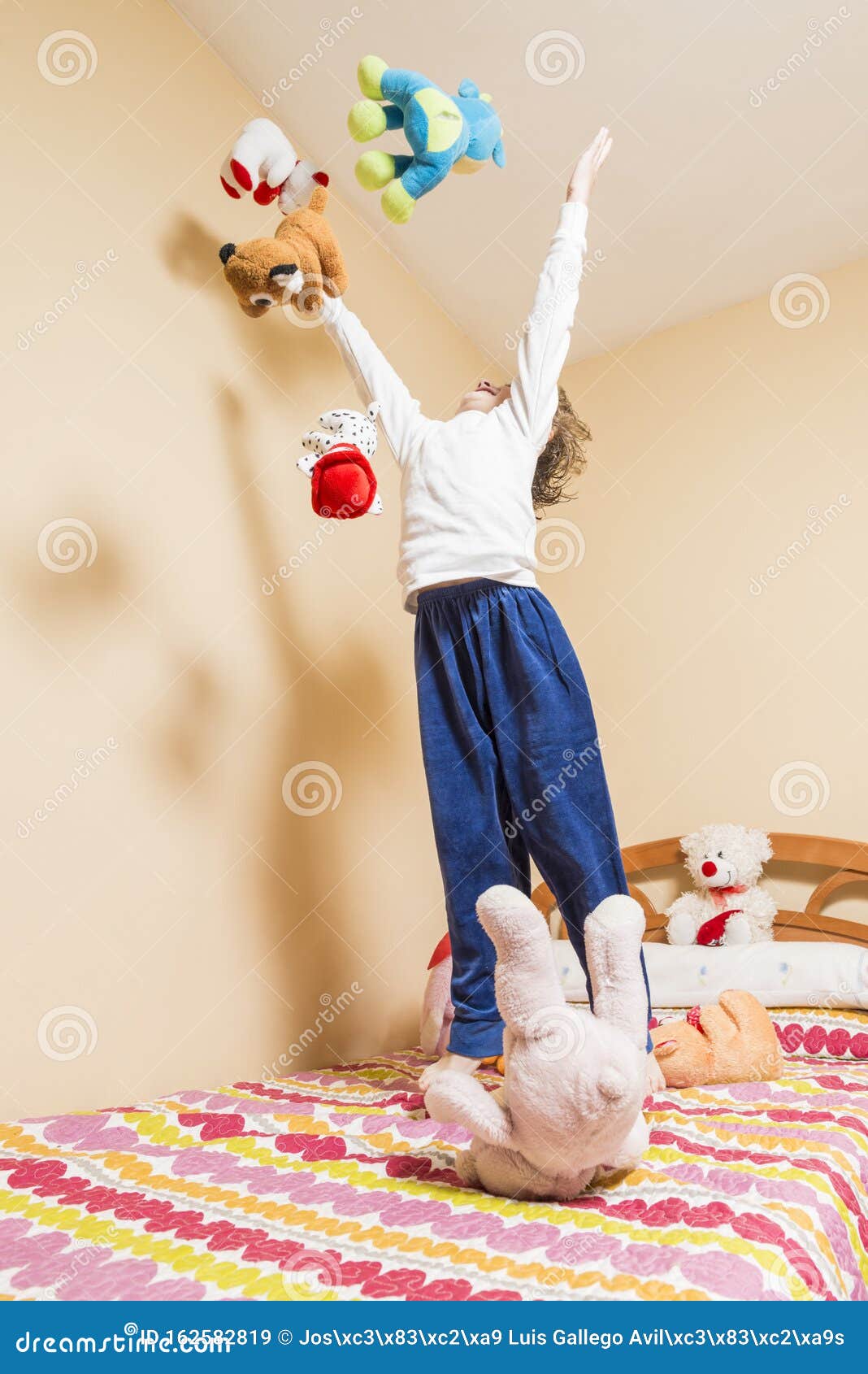 Child Throwing a Lot of Stuffed Animals in the Air Stock Image - Image ...