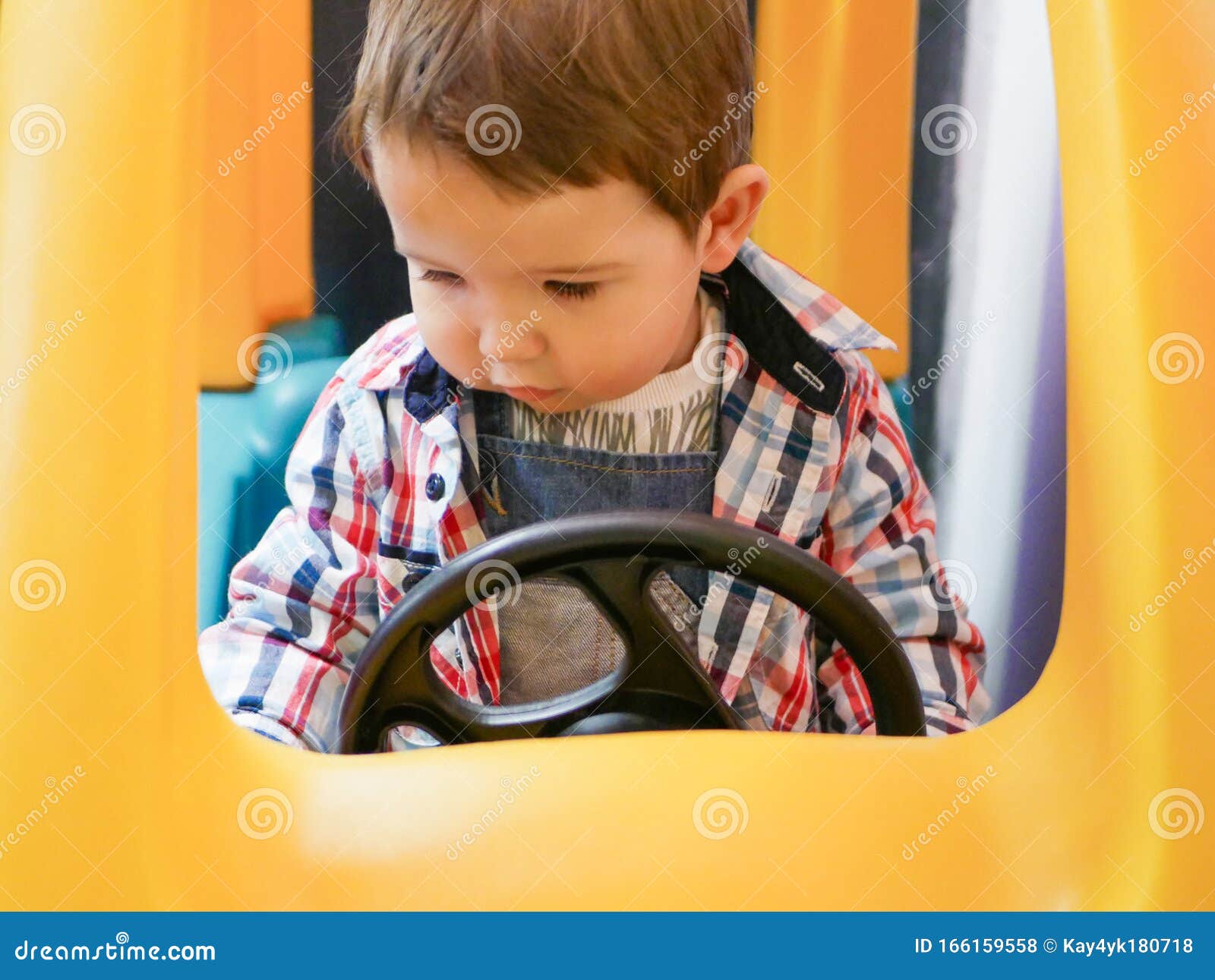 Child on a Toy Car. the Car is Yellow Stock Photo - Image of little ...