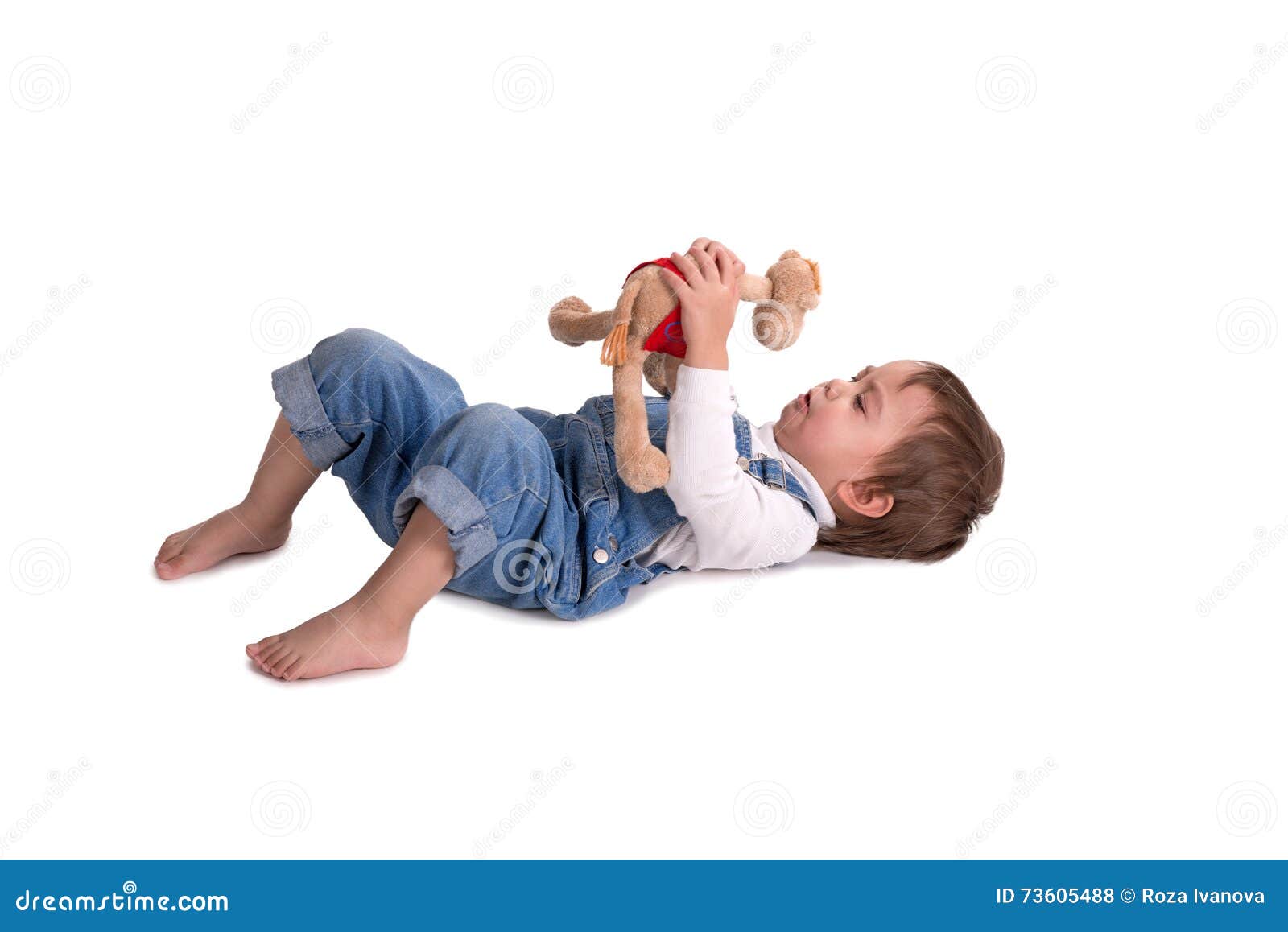 The child with a toy cries stock photo. Image of full - 73605488