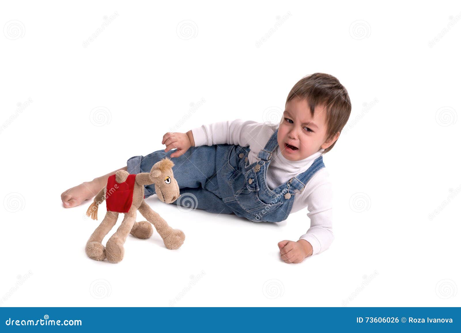The child with a toy cries stock photo. Image of white - 73606026
