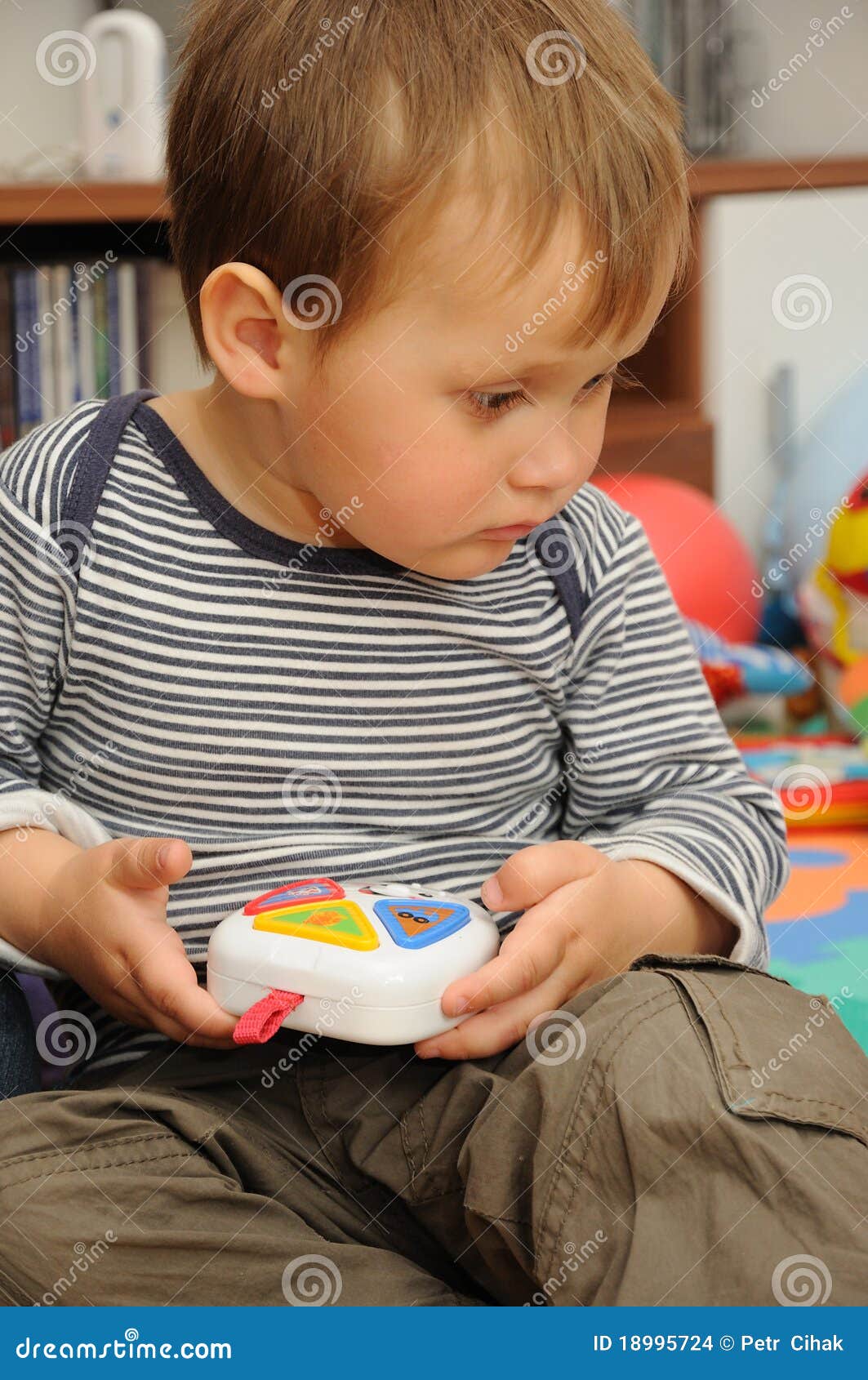 Child with toy in hands stock photo. Image of active - 18995724