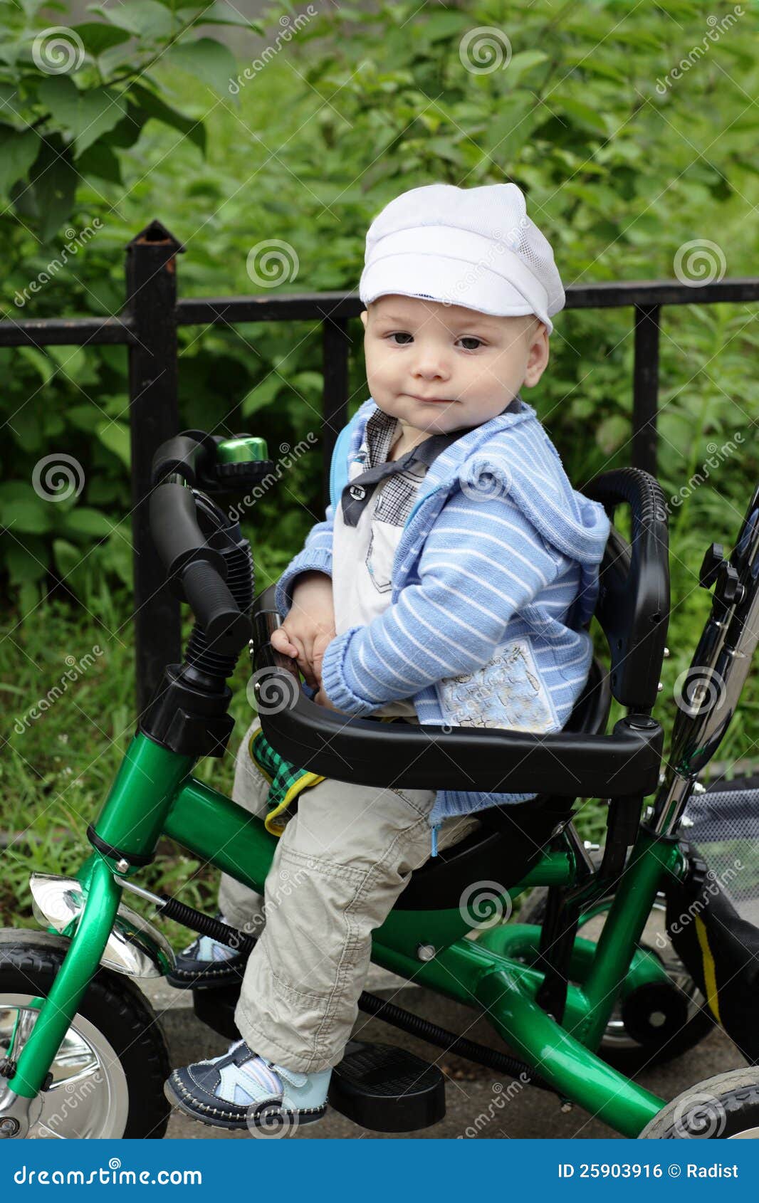 Child on tricycle in park stock photo. Image of child - 25903916