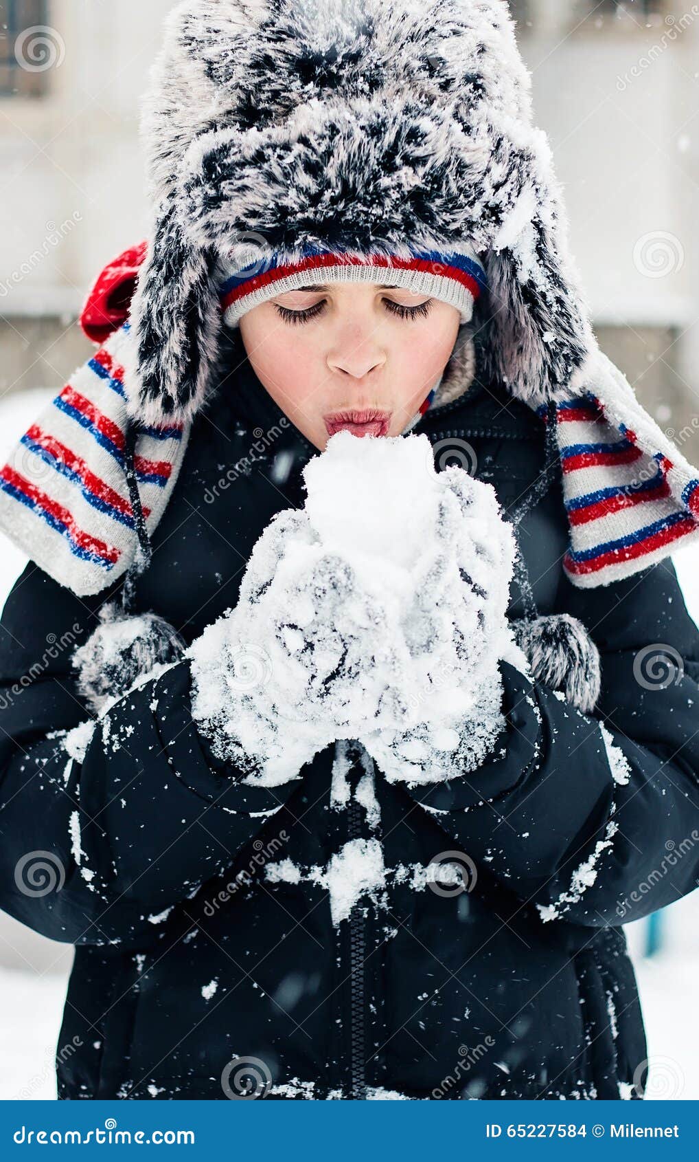 Child tries taste of snow stock photo. Image of happy - 65227584