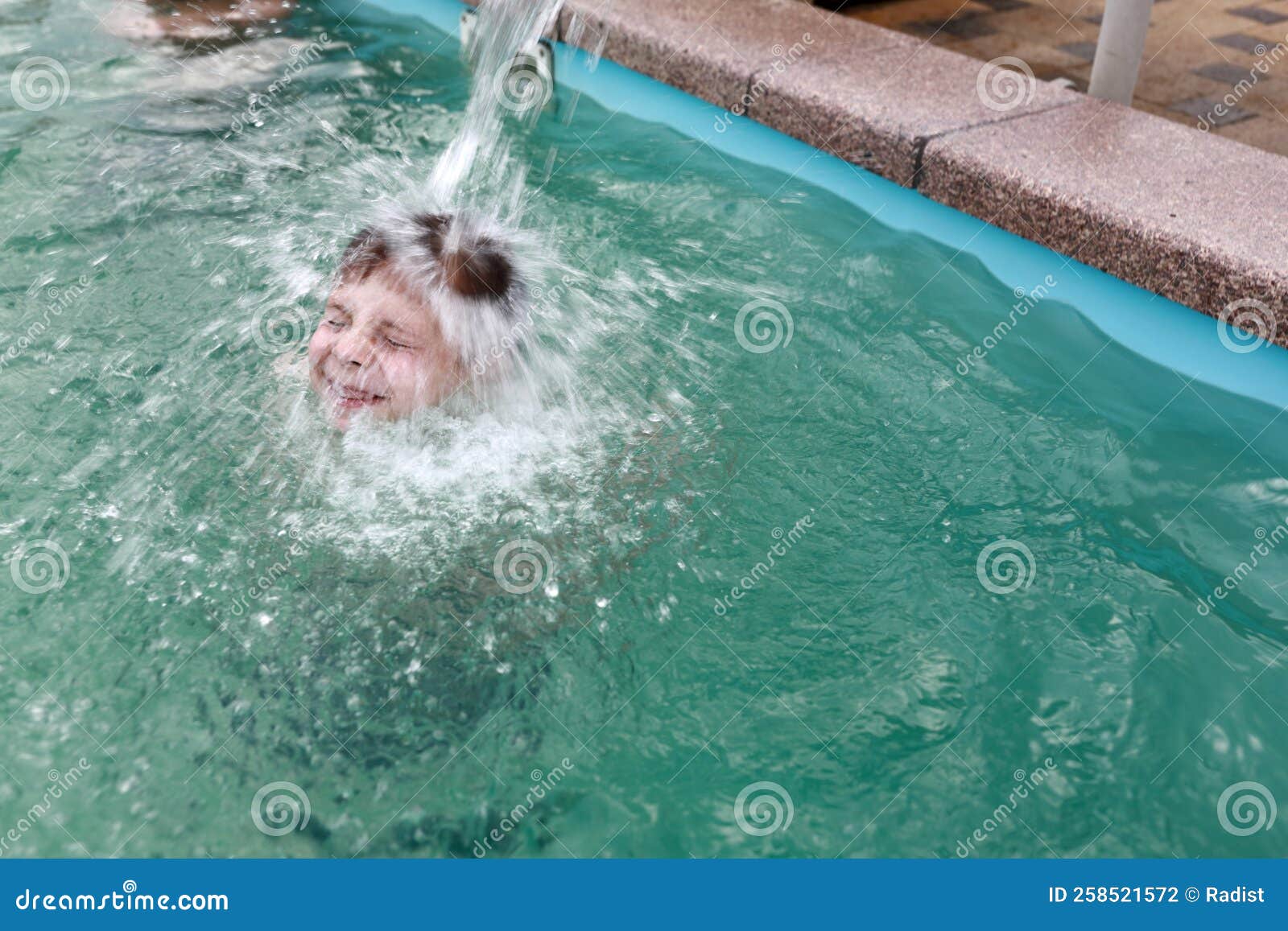 Child Under Stream of Water in Pool Stock Photo - Image of blue, face ...