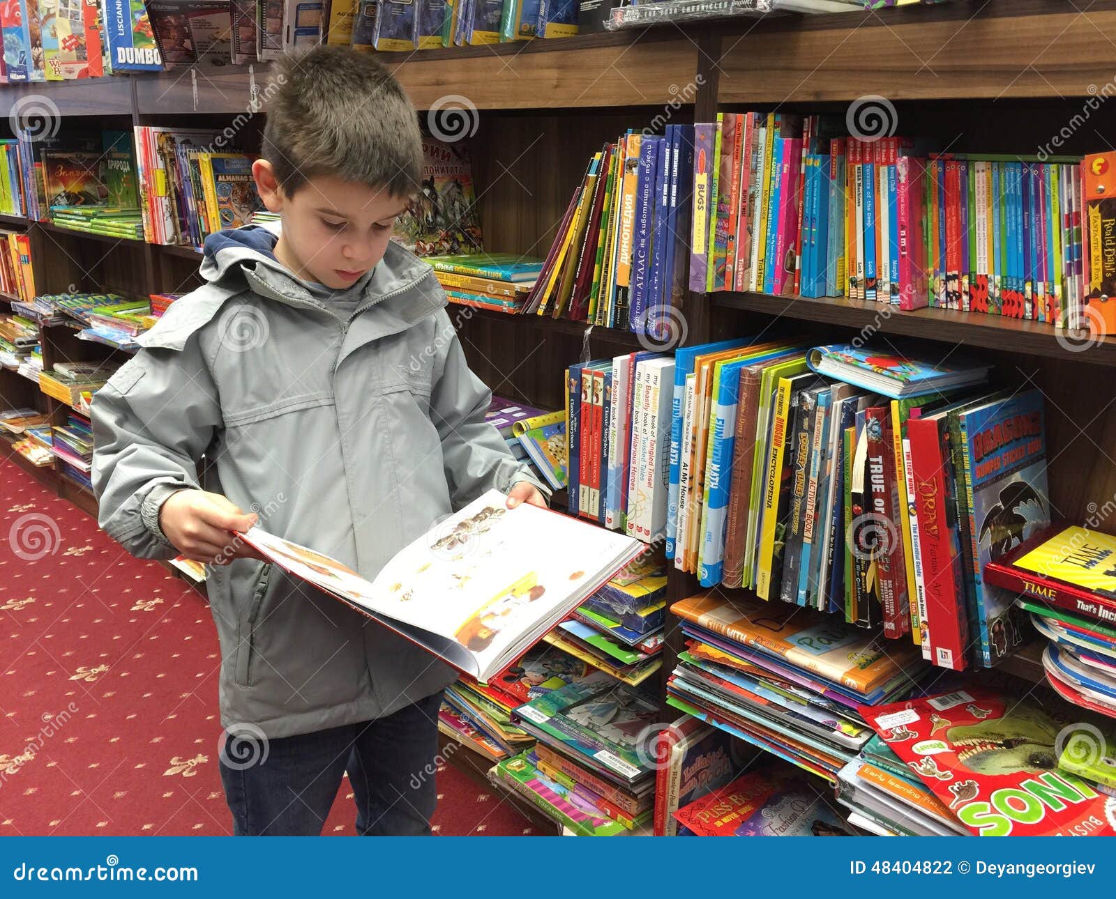 Child with Unfold Book in a Bookstore Editorial Photography - Image of ...