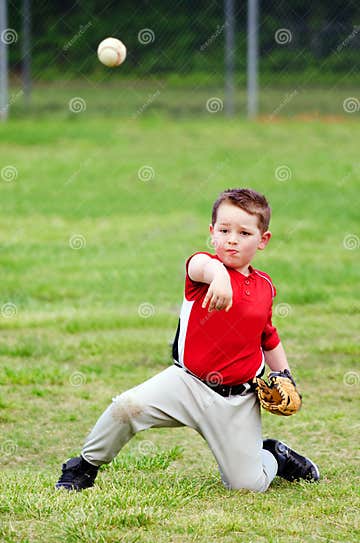 Child in Uniform Throwing Baseball Stock Photo - Image of throwing ...