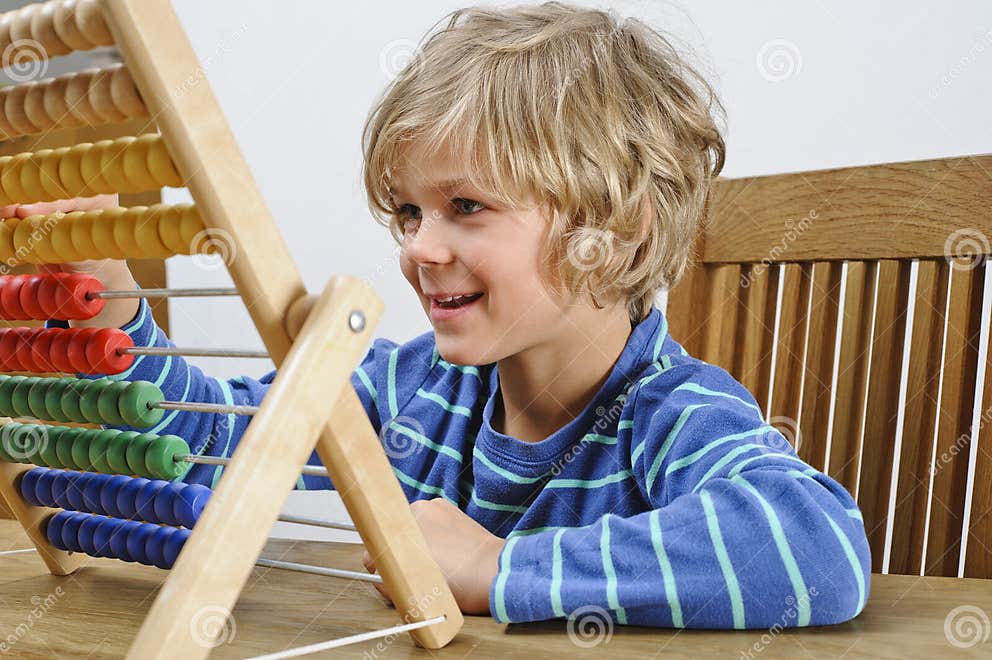 Child using an abacus stock image. Image of homework - 51754441
