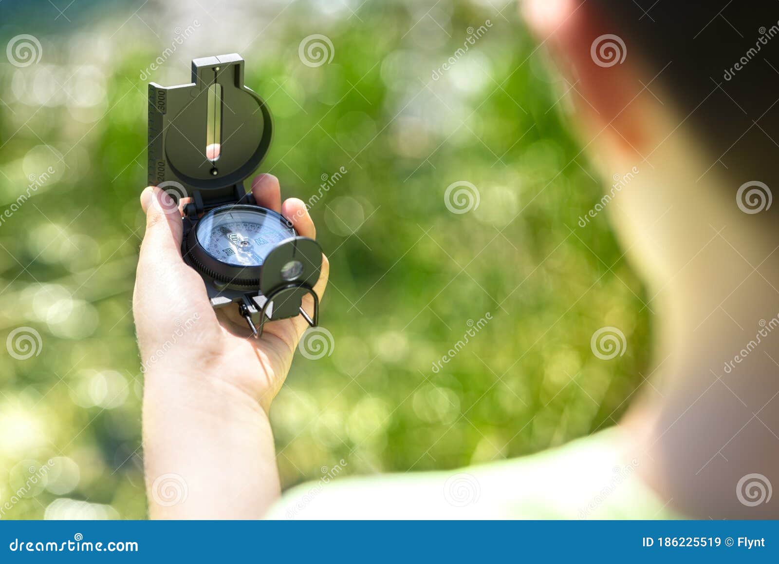 Child Using a Compass for Navigation by a Lake Stock Image - Image of ...