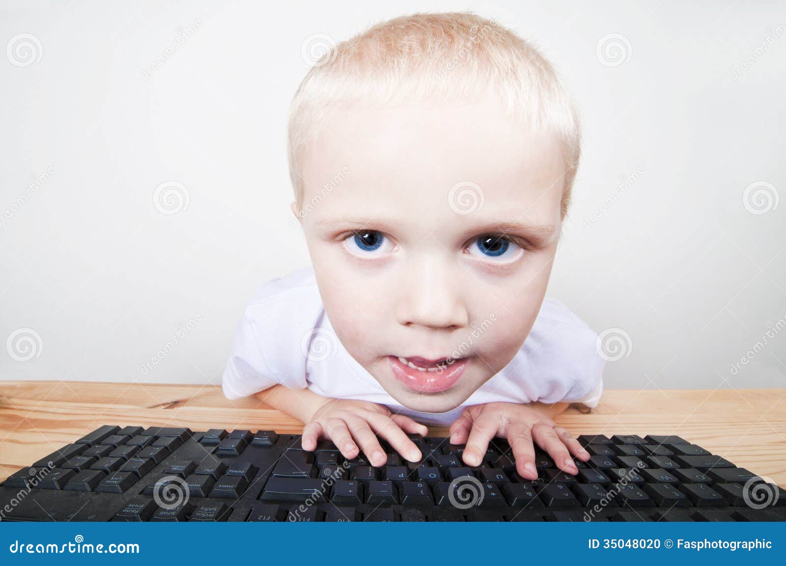 Child using a computer stock photo. Image of home, glasses - 35048020