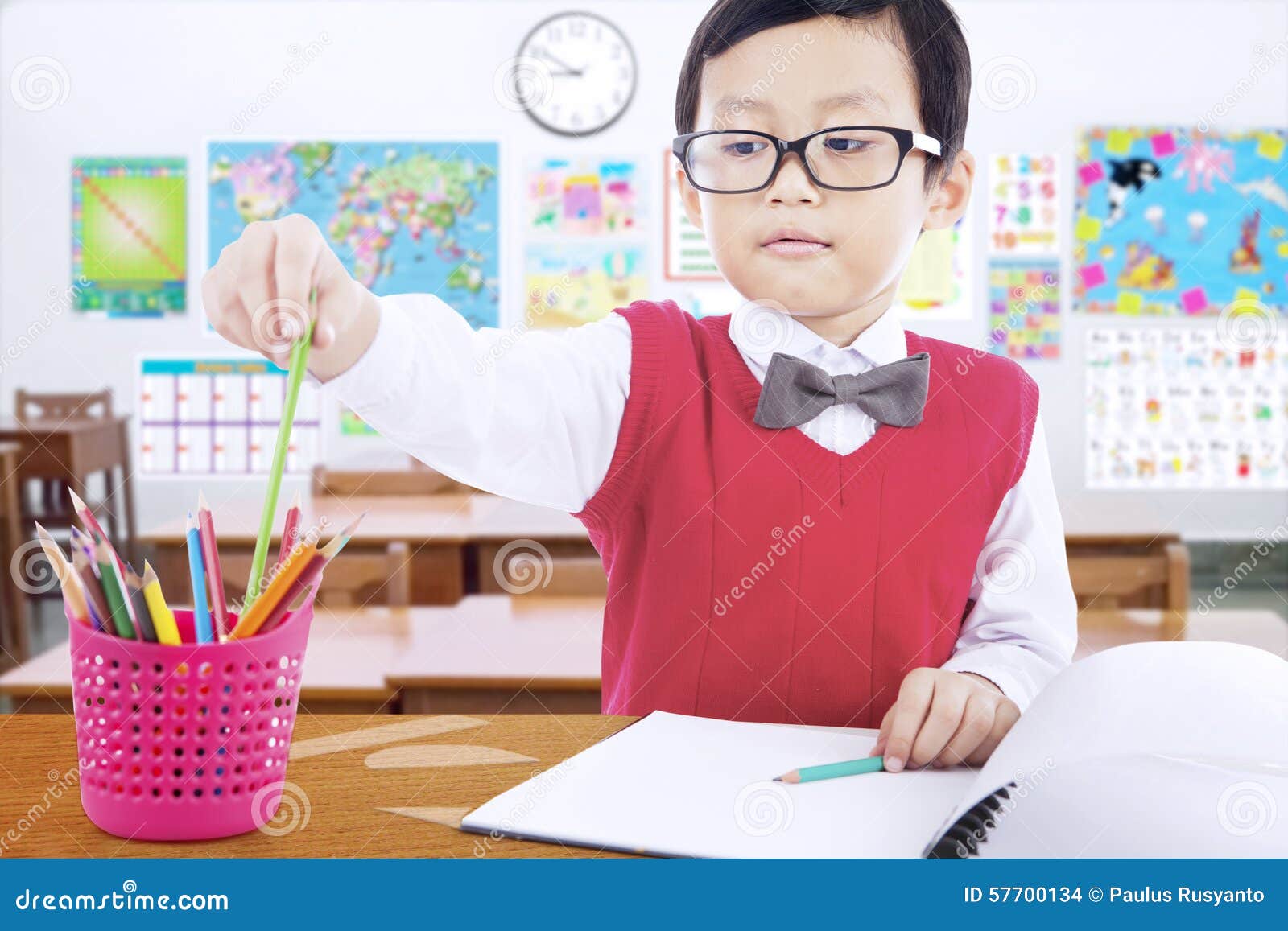 Child Using Crayon To Draw in the Class Stock Photo - Image of hispanic ...