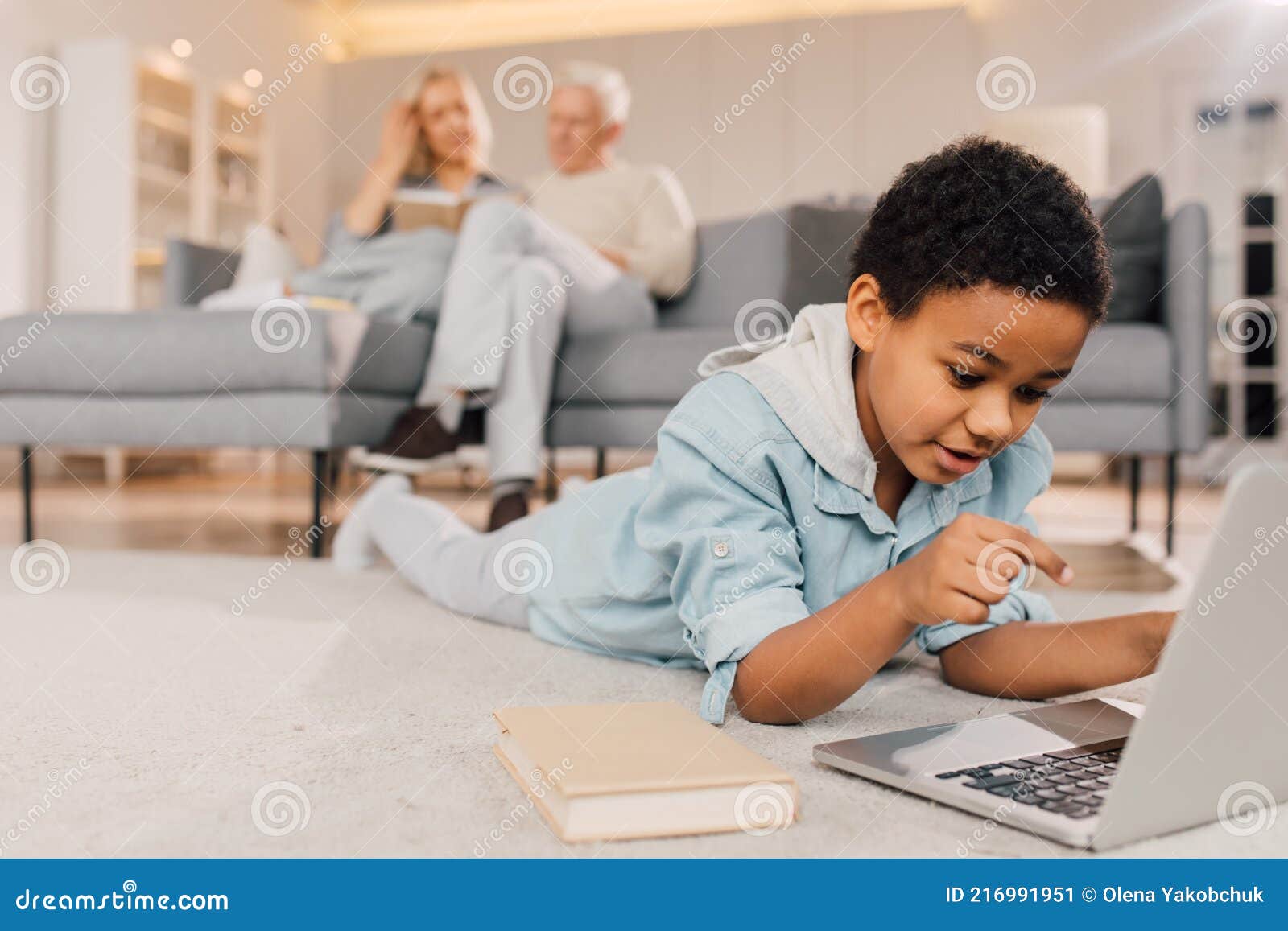 Child Using Laptop Computer, while Studying through Online E-learning ...