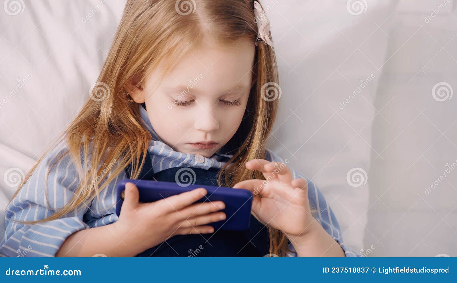 Child Using Mobile Phone on Bed Stock Image - Image of home, child ...