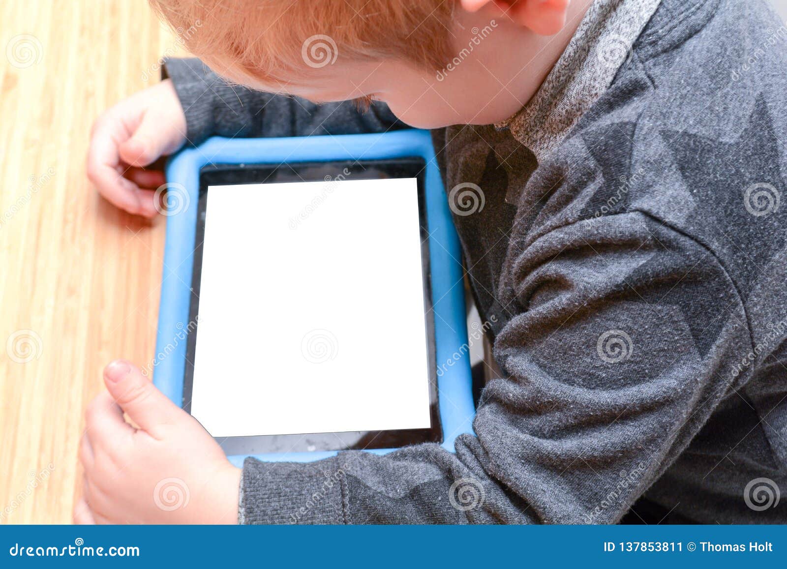Child Using a Tablet Computer To Learn and Play Games, Model is Young ...