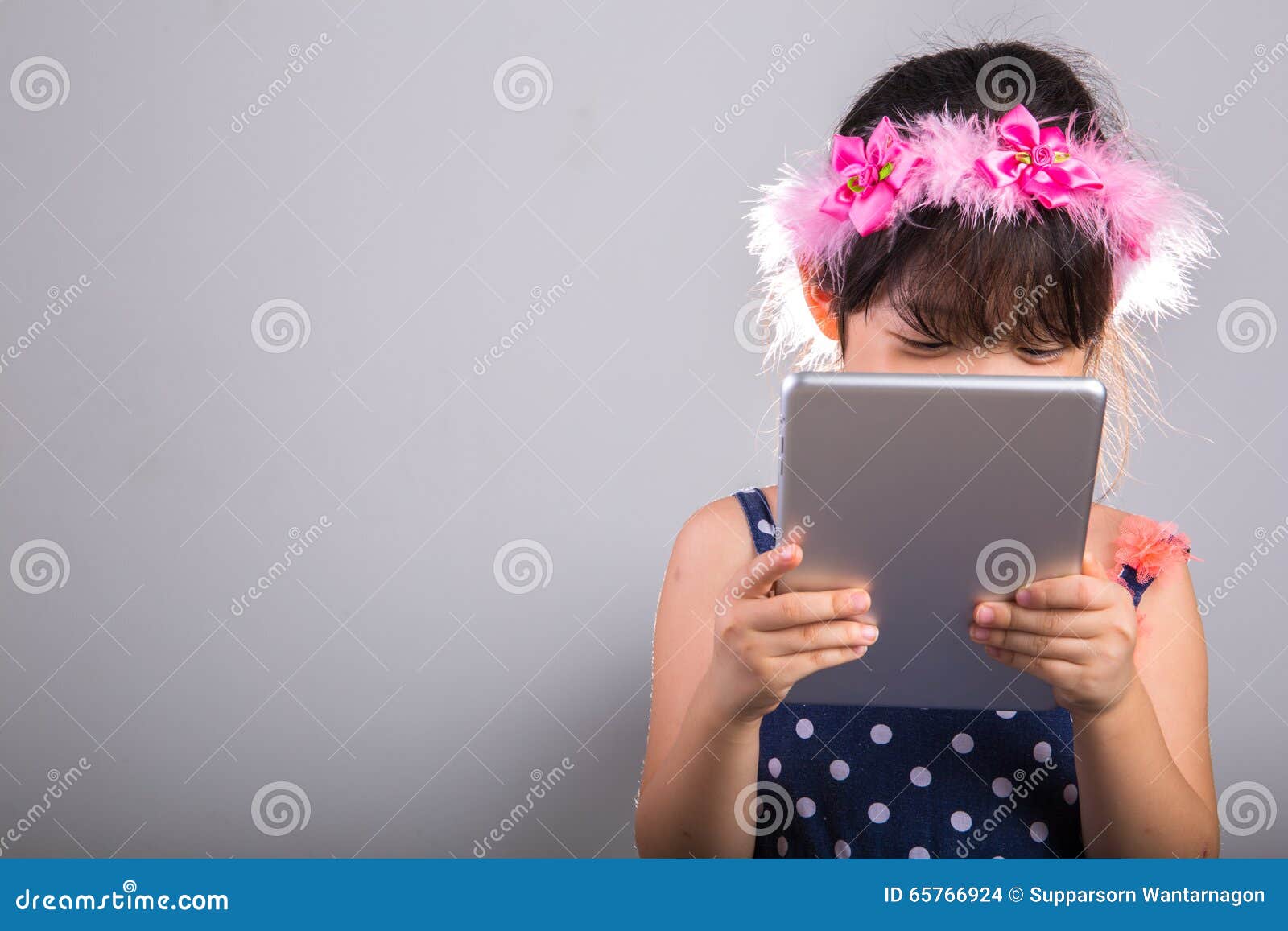Child Using Tablet / Little Girl with Tablet Background Stock Photo ...