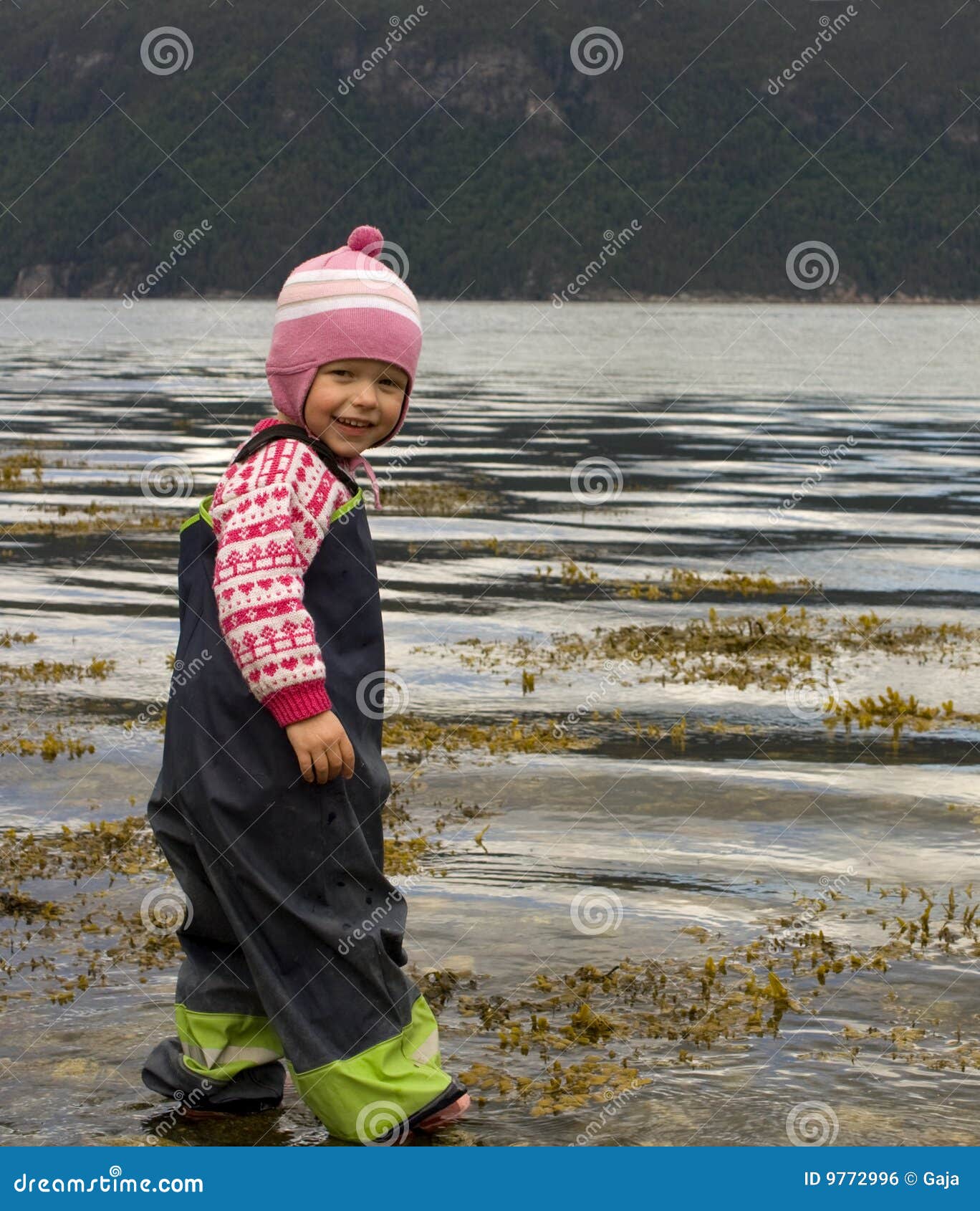Child wading stock photo. Image of smiling, sweater, wool - 9772996