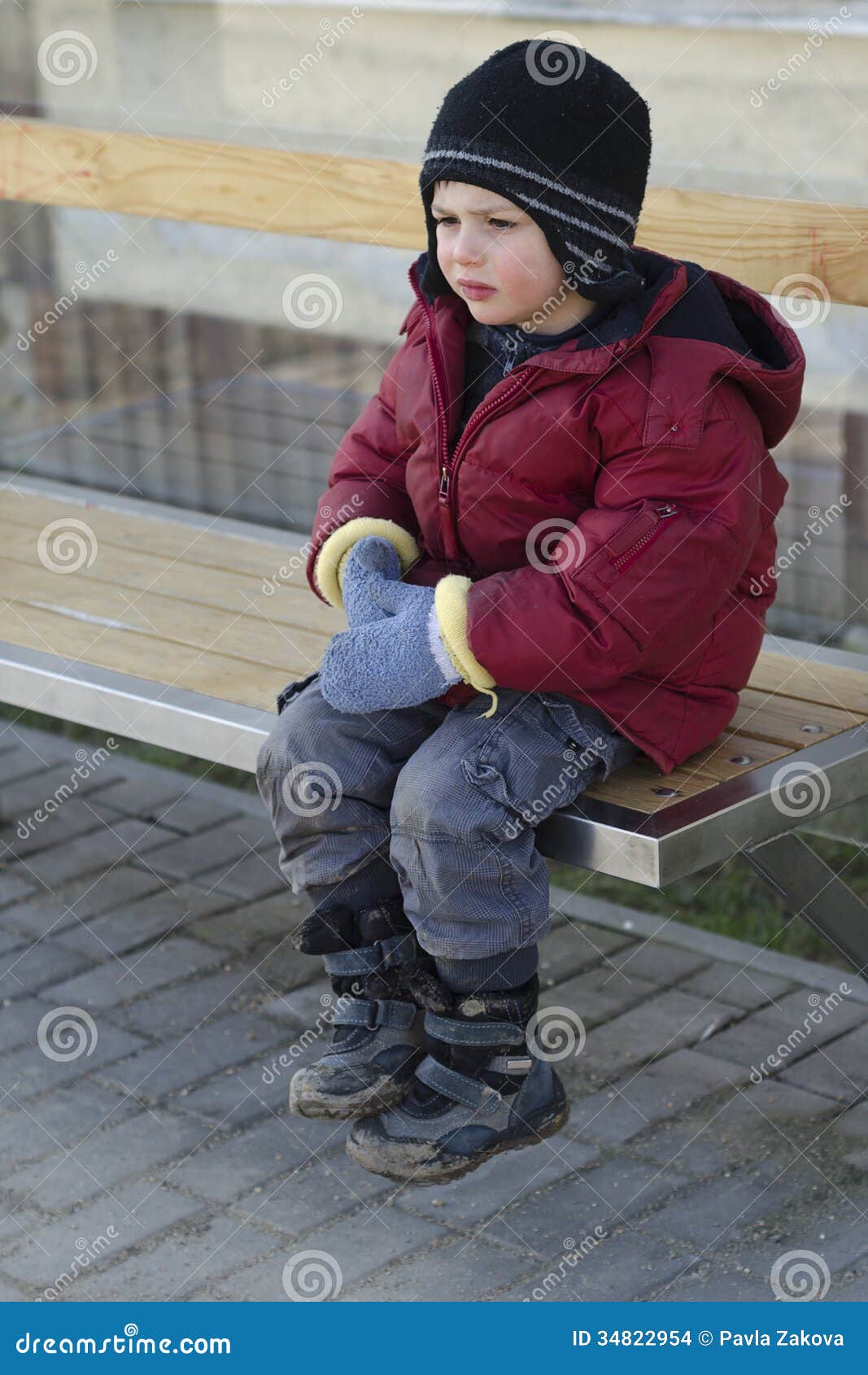 Child waiting at bus stop stock photo. Image of sitting - 34822954