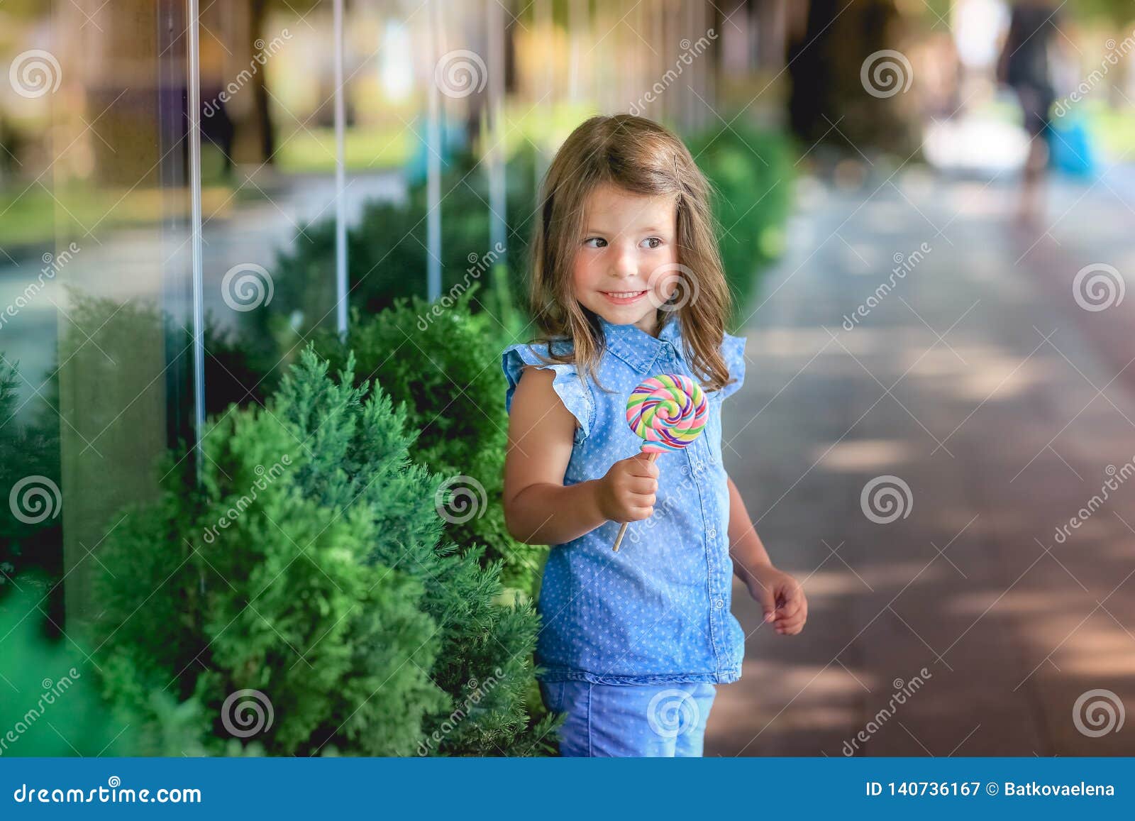 Child for a Walk in the Park with Candy in Hand Stock Image - Image of ...