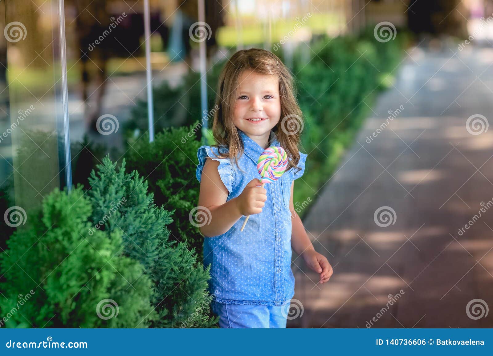 Child for a Walk in the Park with Candy in Hand Stock Photo - Image of ...
