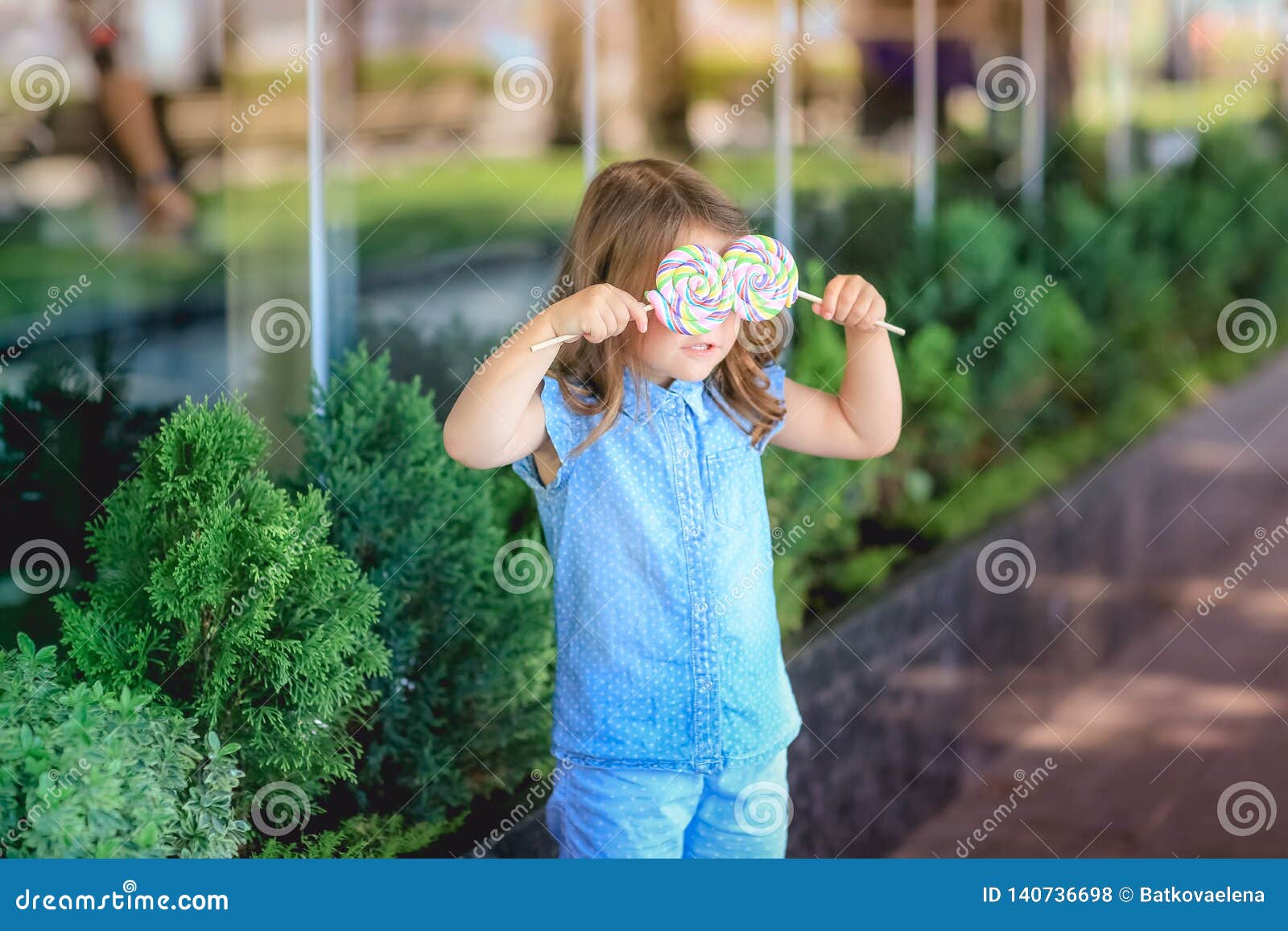 Child for a Walk in the Park with Candy in Hand Stock Photo - Image of ...