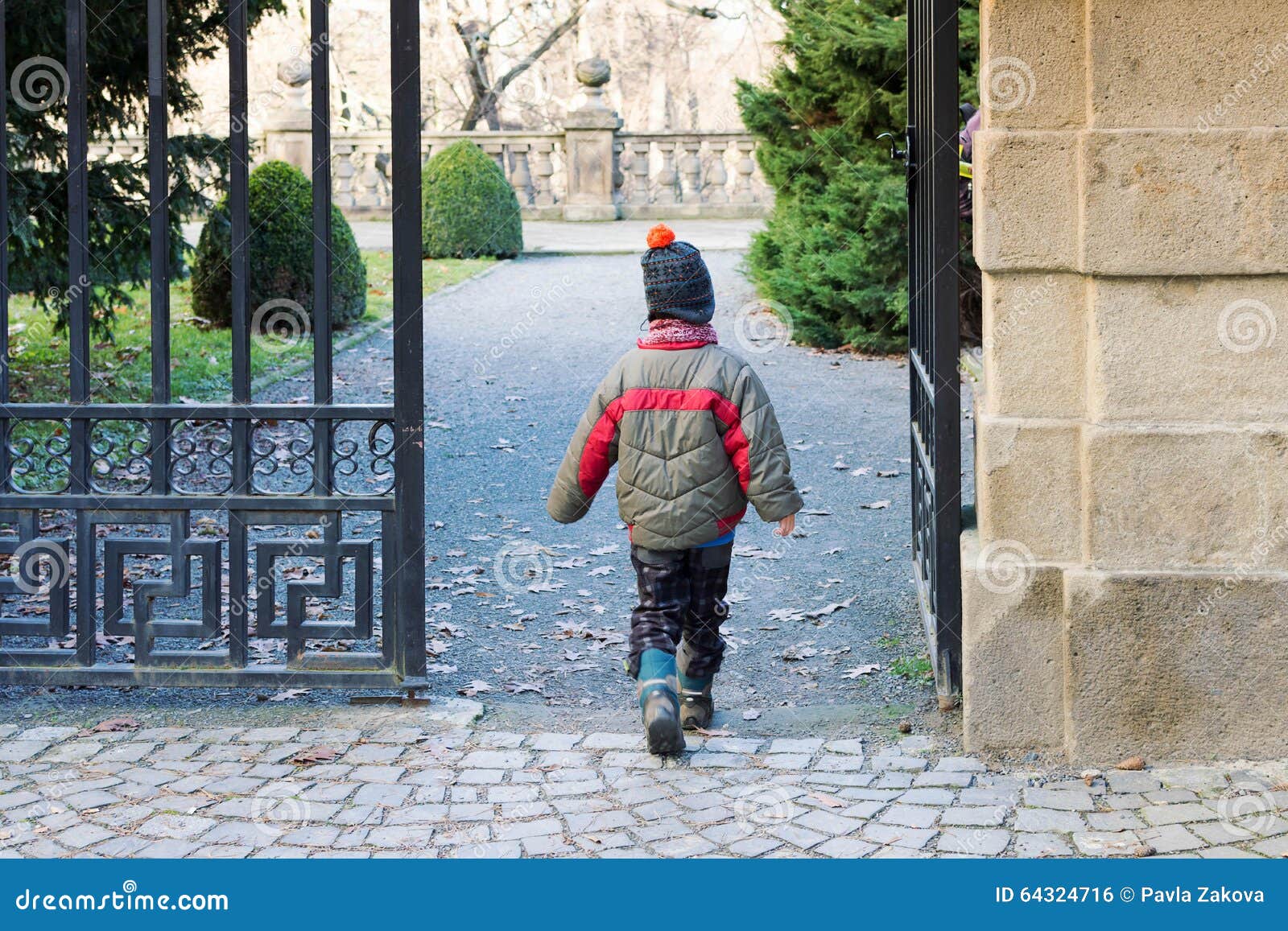 Child Walking through a Gate into a Park or Garden Stock Photo - Image ...