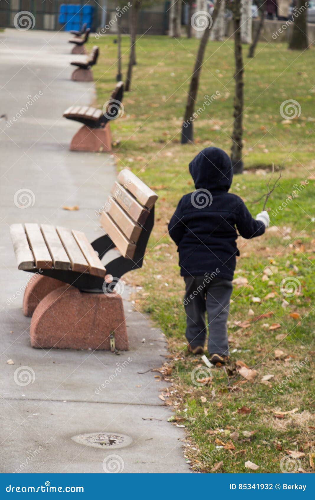 Child Walking by the Wooden Park Bench at a Park Stock Photo - Image of ...