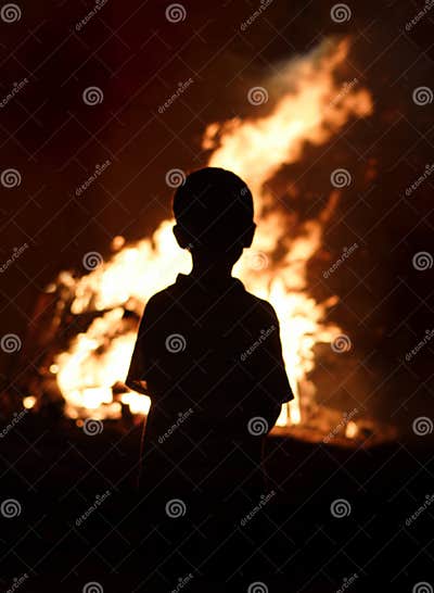 Child watching the fire stock image. Image of suffering - 3211671
