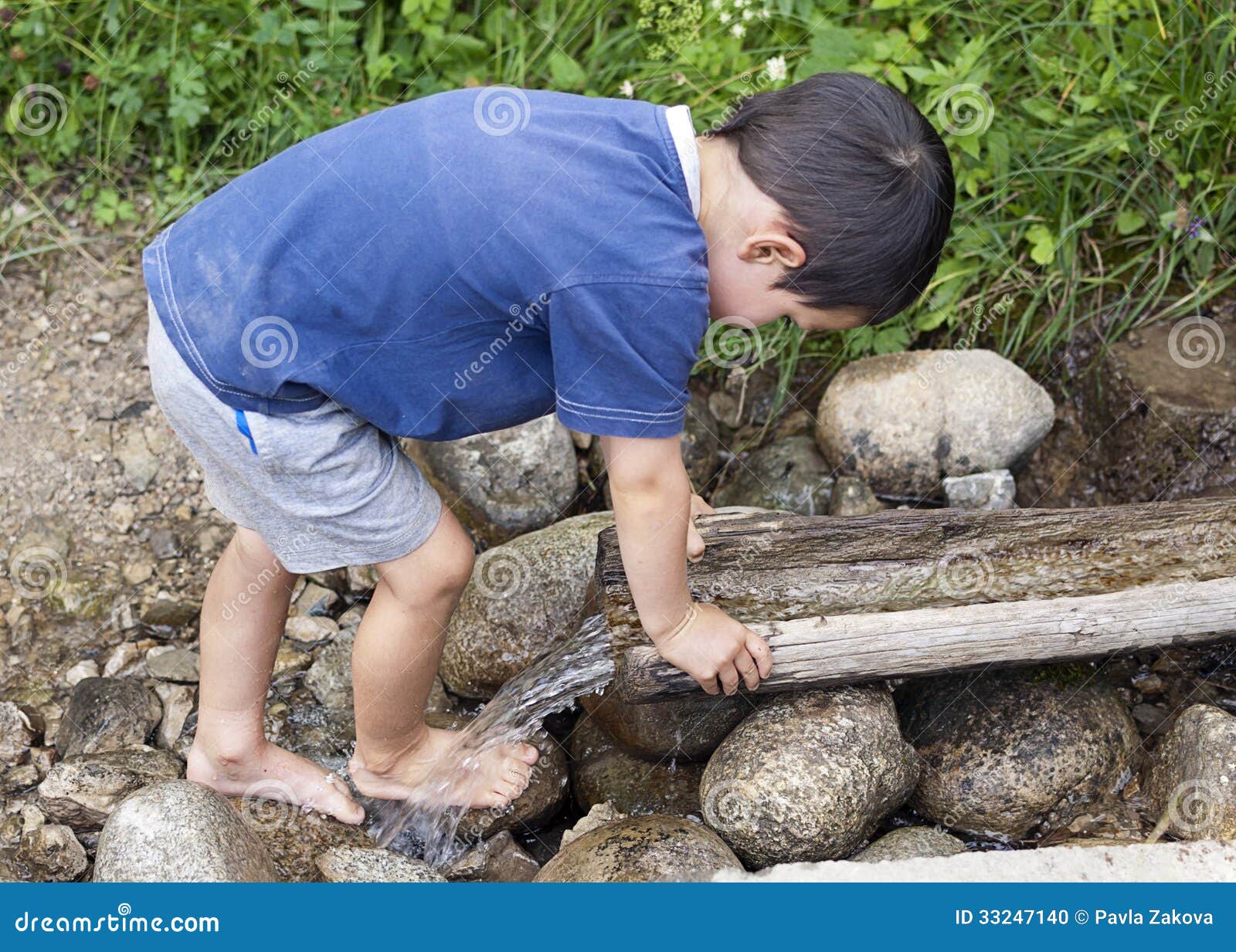 Child at water stream stock photo. Image of green, happy - 33247140