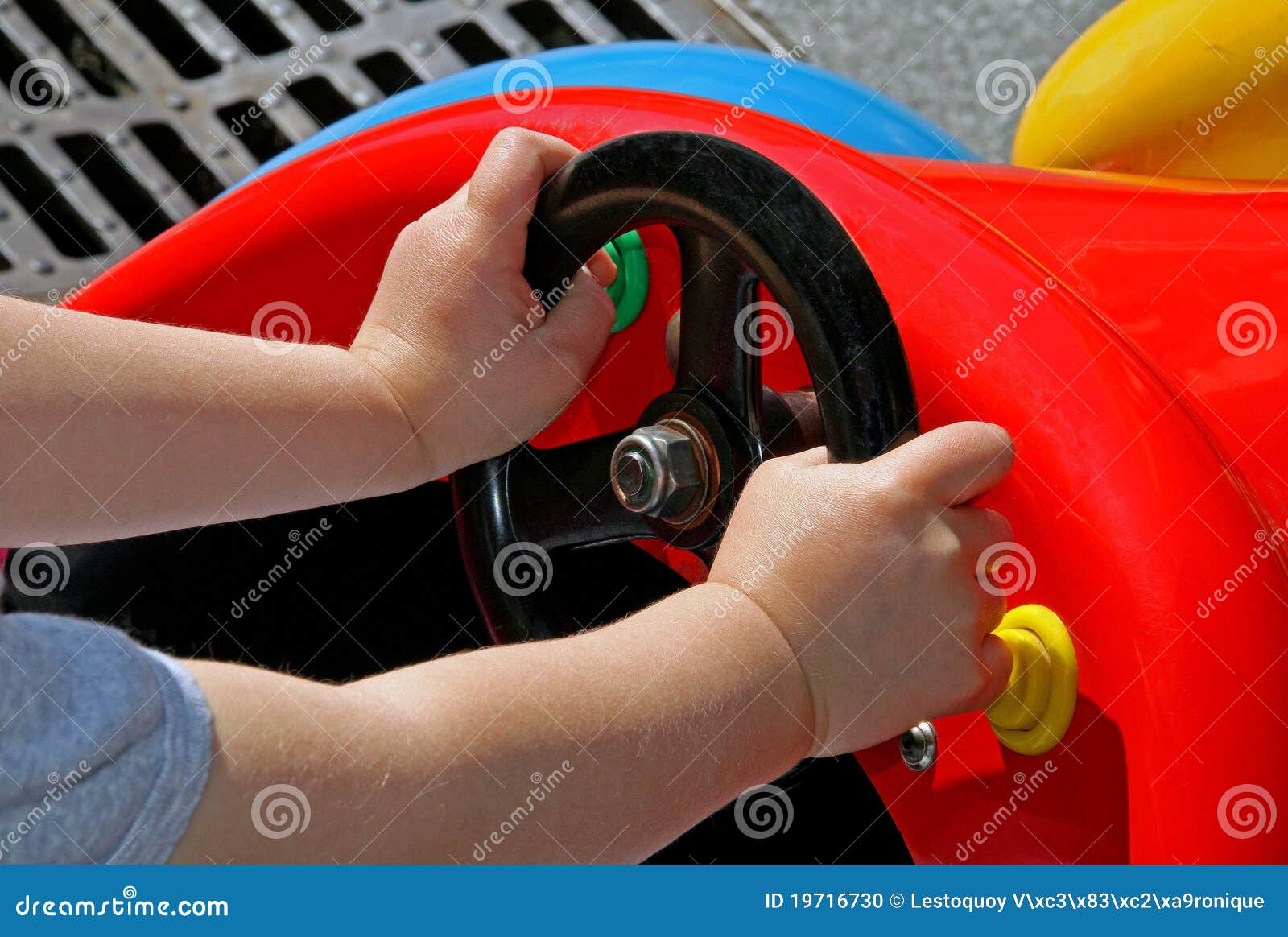 Child at the wheel stock photo. Image of yellow, hand - 19716730