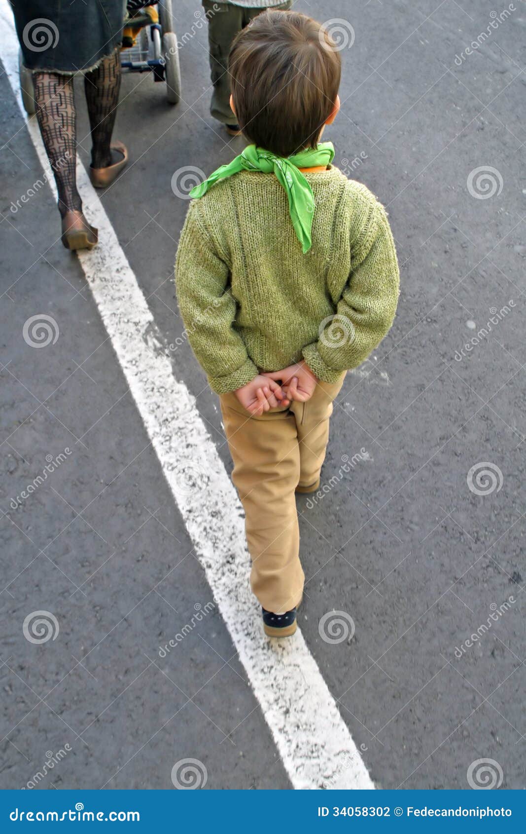 Child Who Walks with His Hands Behind His Back Stock Photo - Image of ...