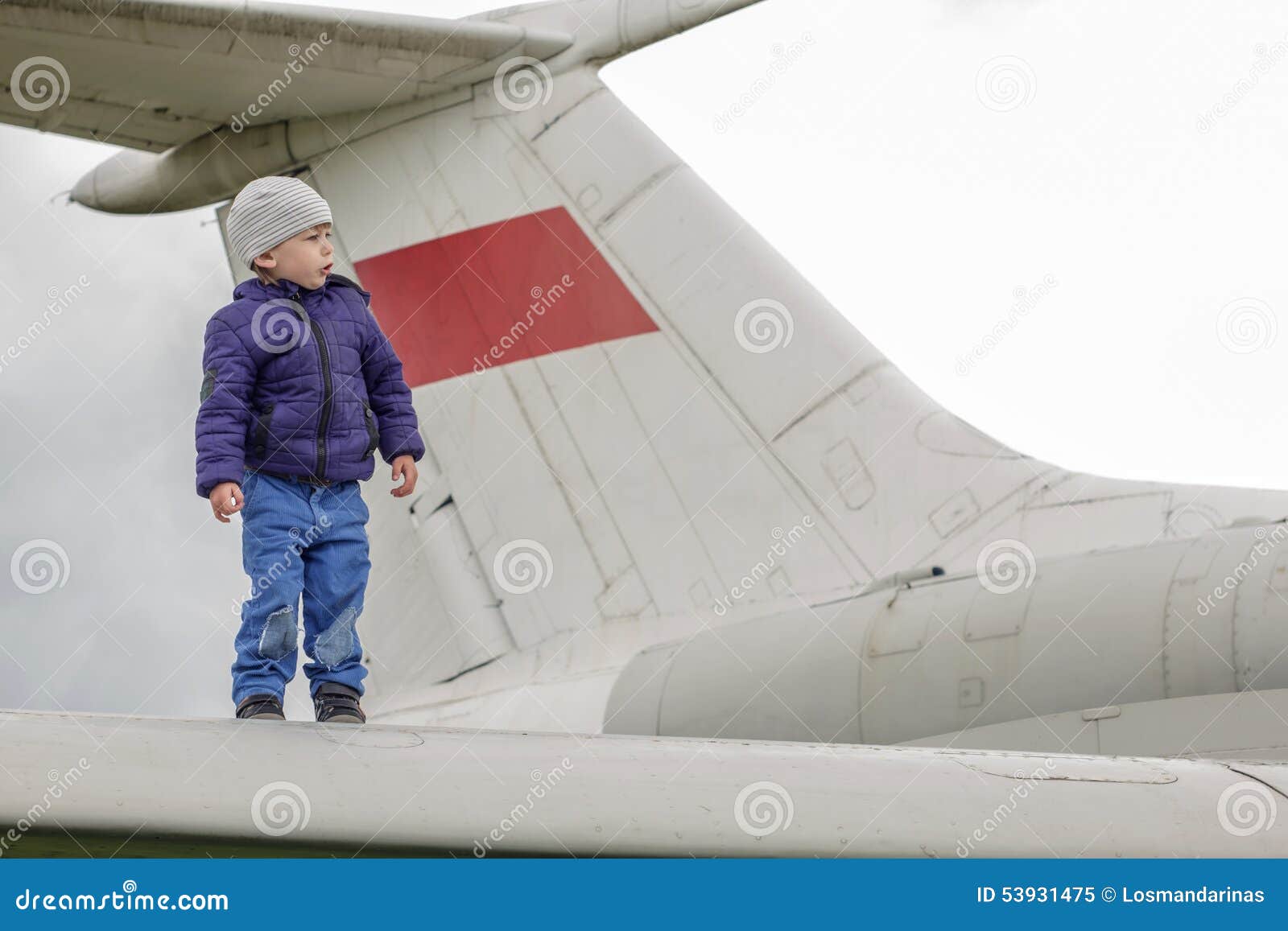 Child on the Wing of a Jet Plane Stock Image - Image of airplane ...
