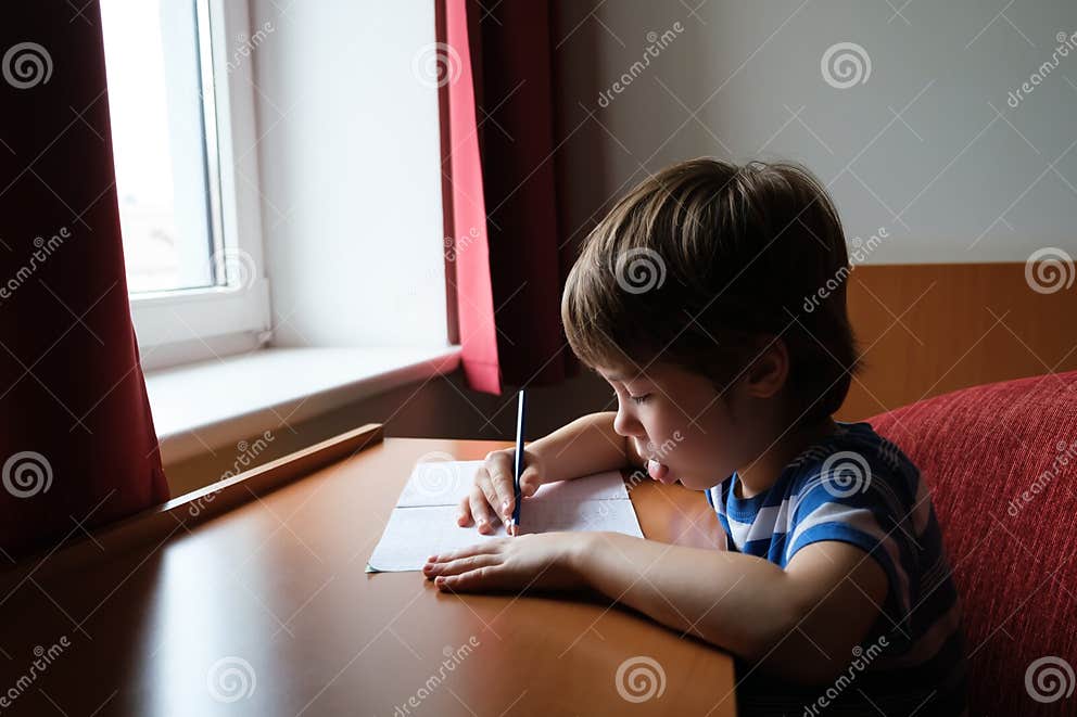 The Child Writes Down the Answer To the Solution of the Example in a ...