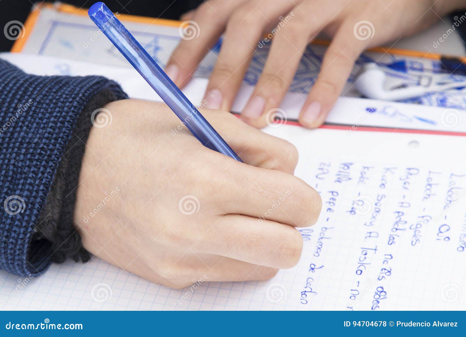 Child writing in the book stock photo. Image of homework - 94704678