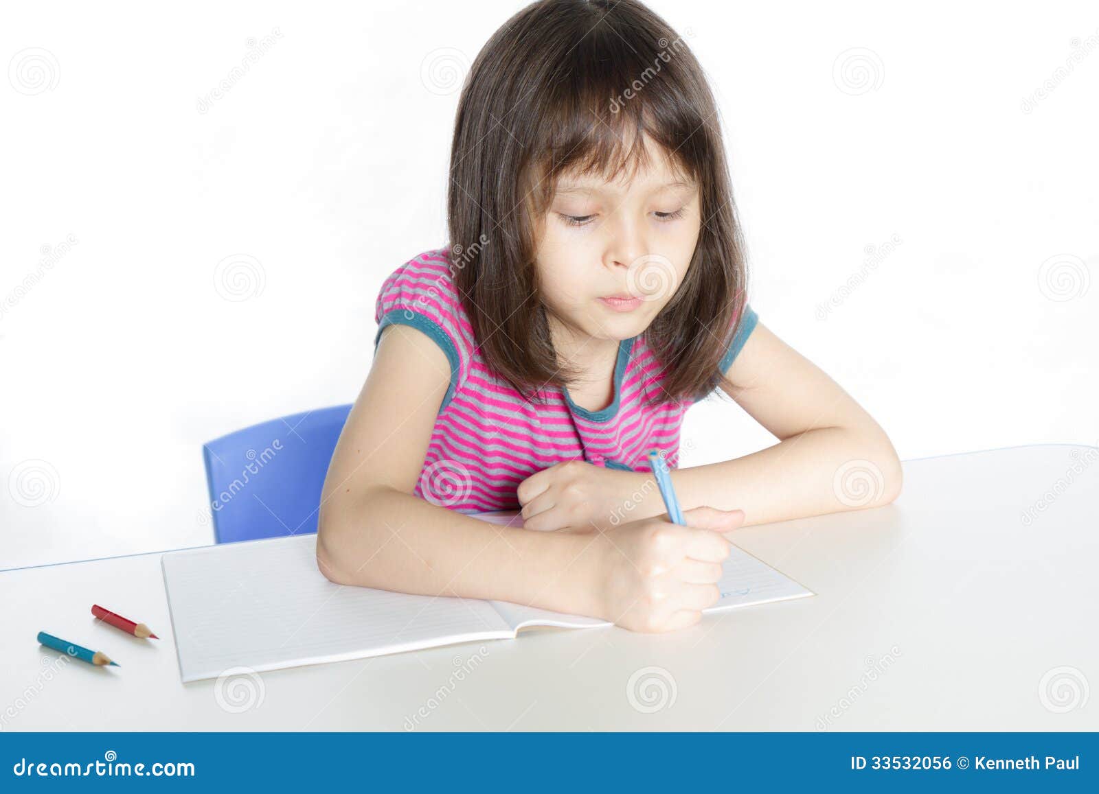 Child writing at desk stock photo. Image of schoolwork - 33532056