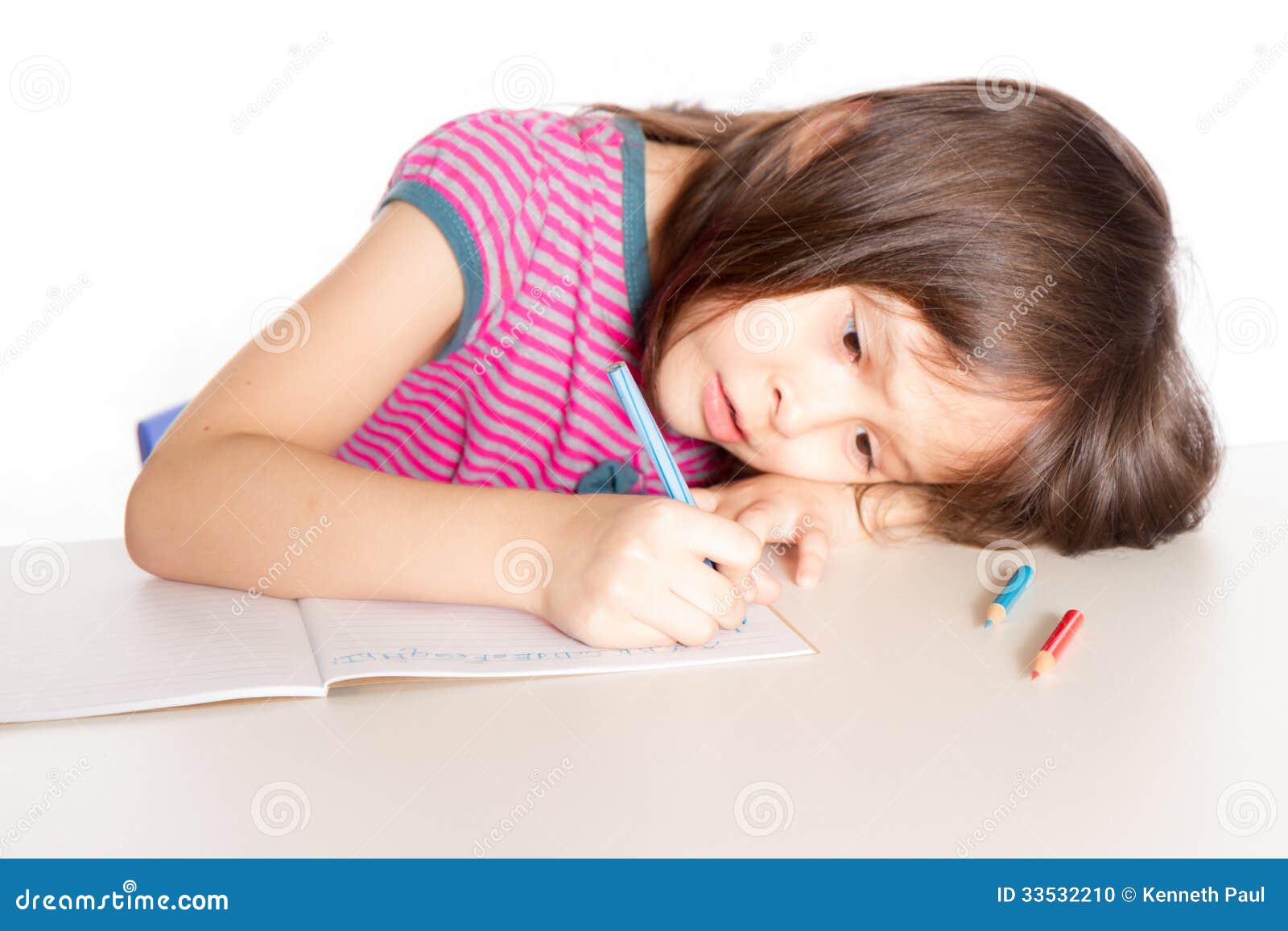 Child writing at desk stock photo. Image of learning - 33532210