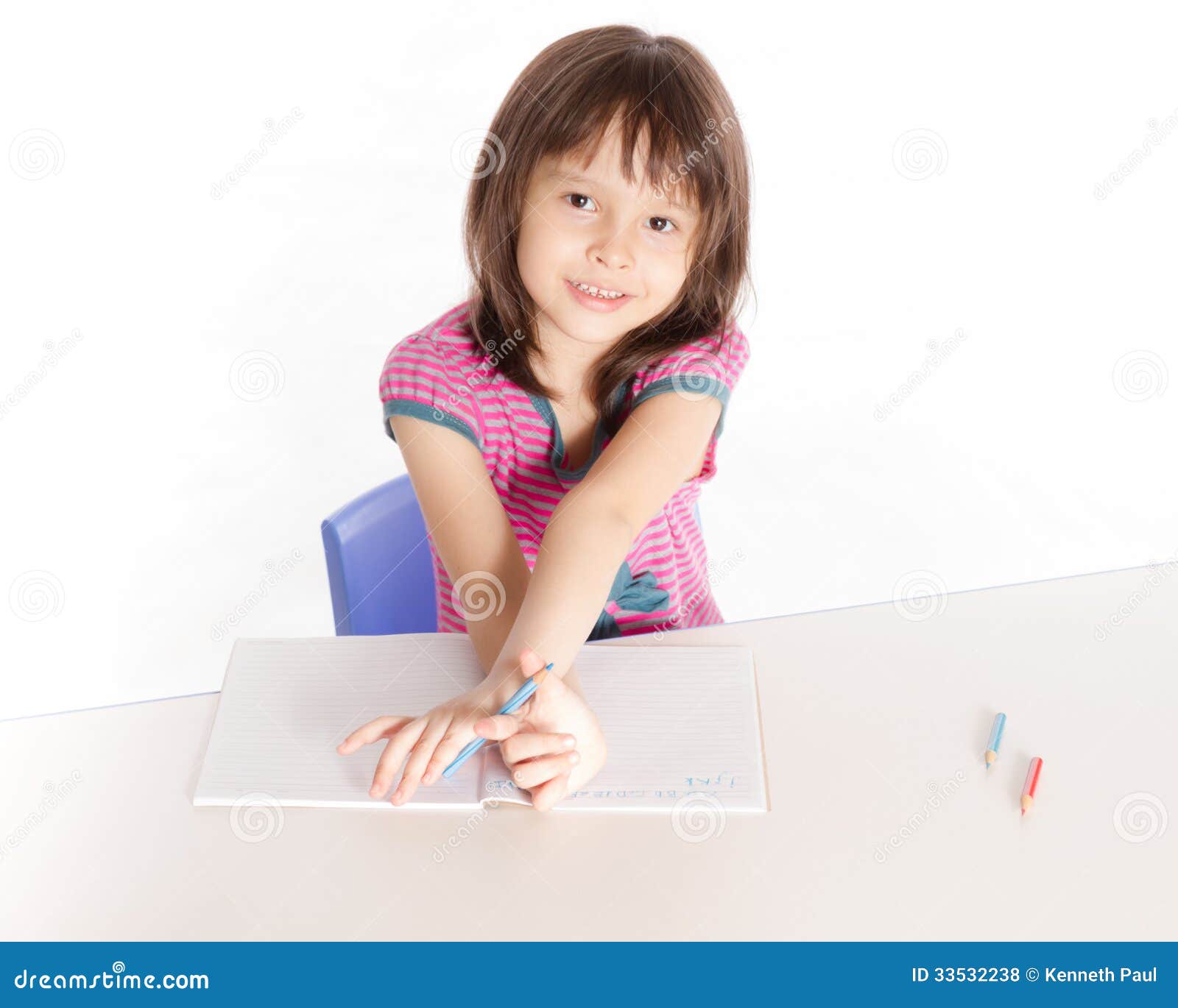 Child writing at desk stock photo. Image of education - 33532238