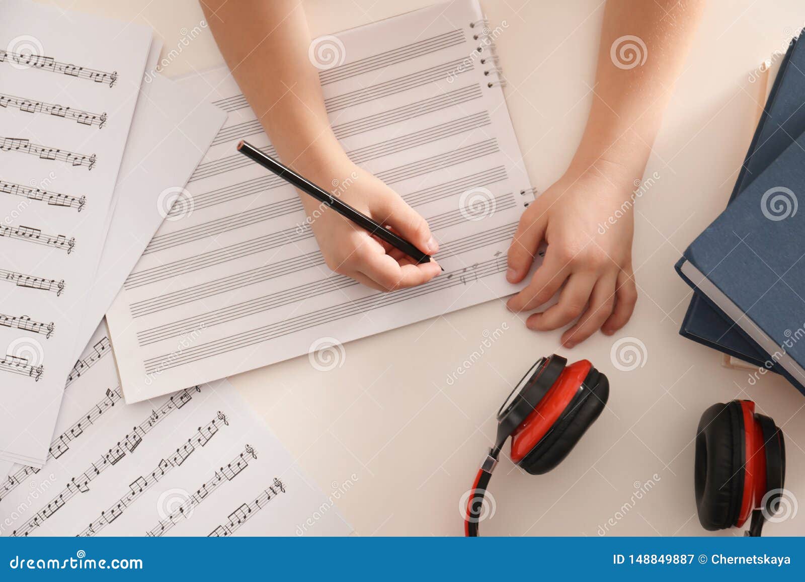 Child Writing Music Notes at Table Stock Image - Image of learn ...