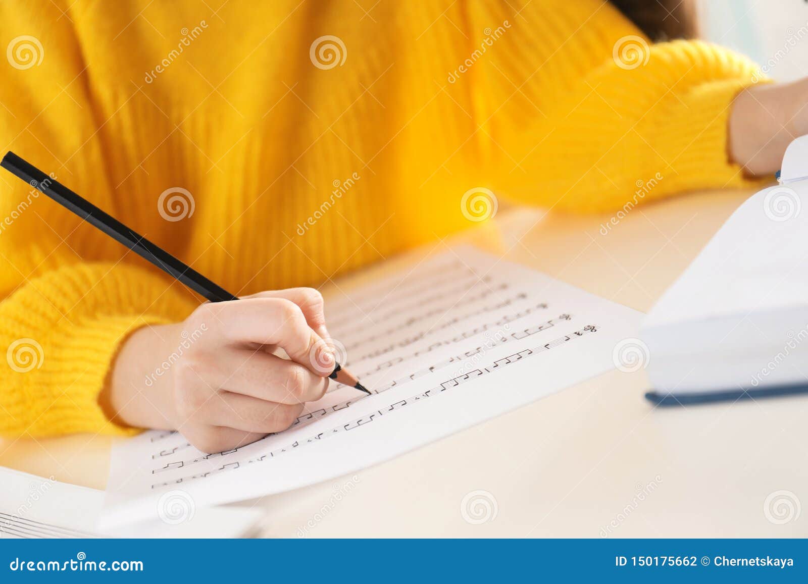 Child Writing Music Notes at Table Stock Photo - Image of class, desk ...