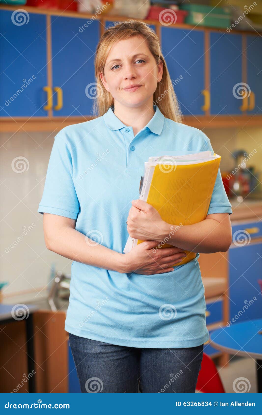 Childcare Worker Standing in Nursery Stock Photo - Image of playgroup ...