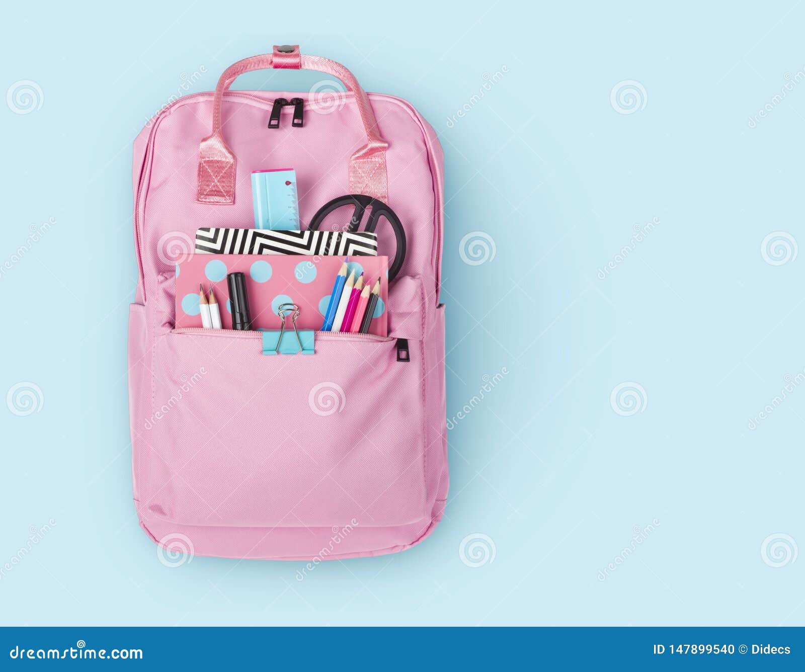 Children Backpack with Various School Stationery Isolated on Blue ...