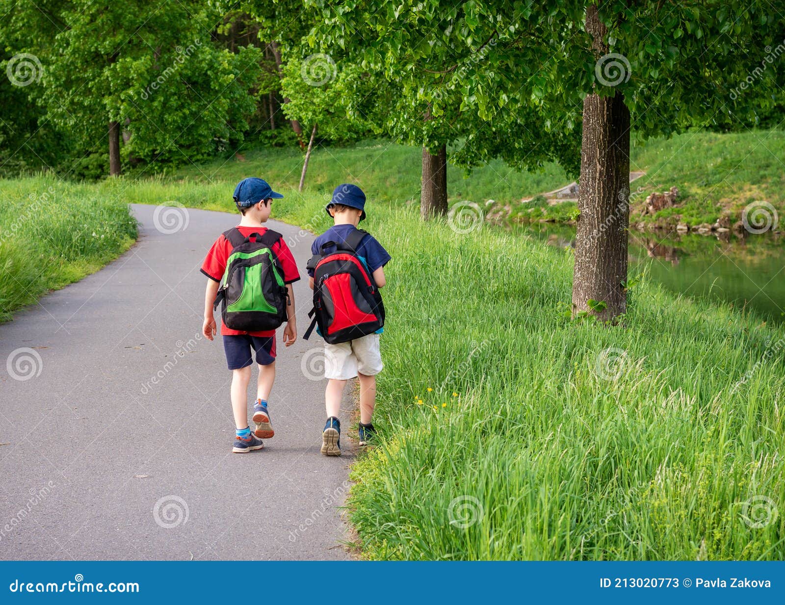 Children with Backpack Walking in Park Stock Image - Image of green ...