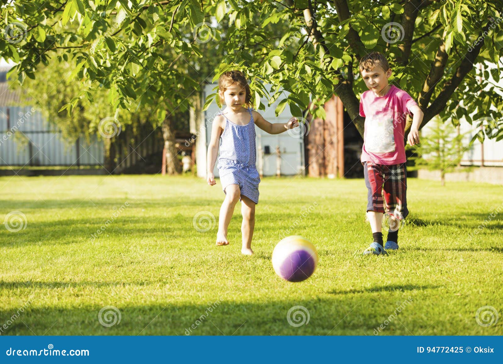 Children with a ball stock image. Image of exercise, grass - 94772425