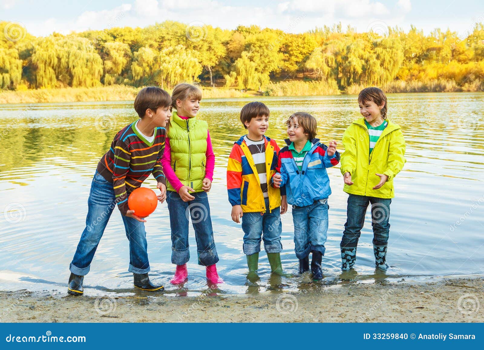 Children with a ball stock photo. Image of boots, colorful - 33259840