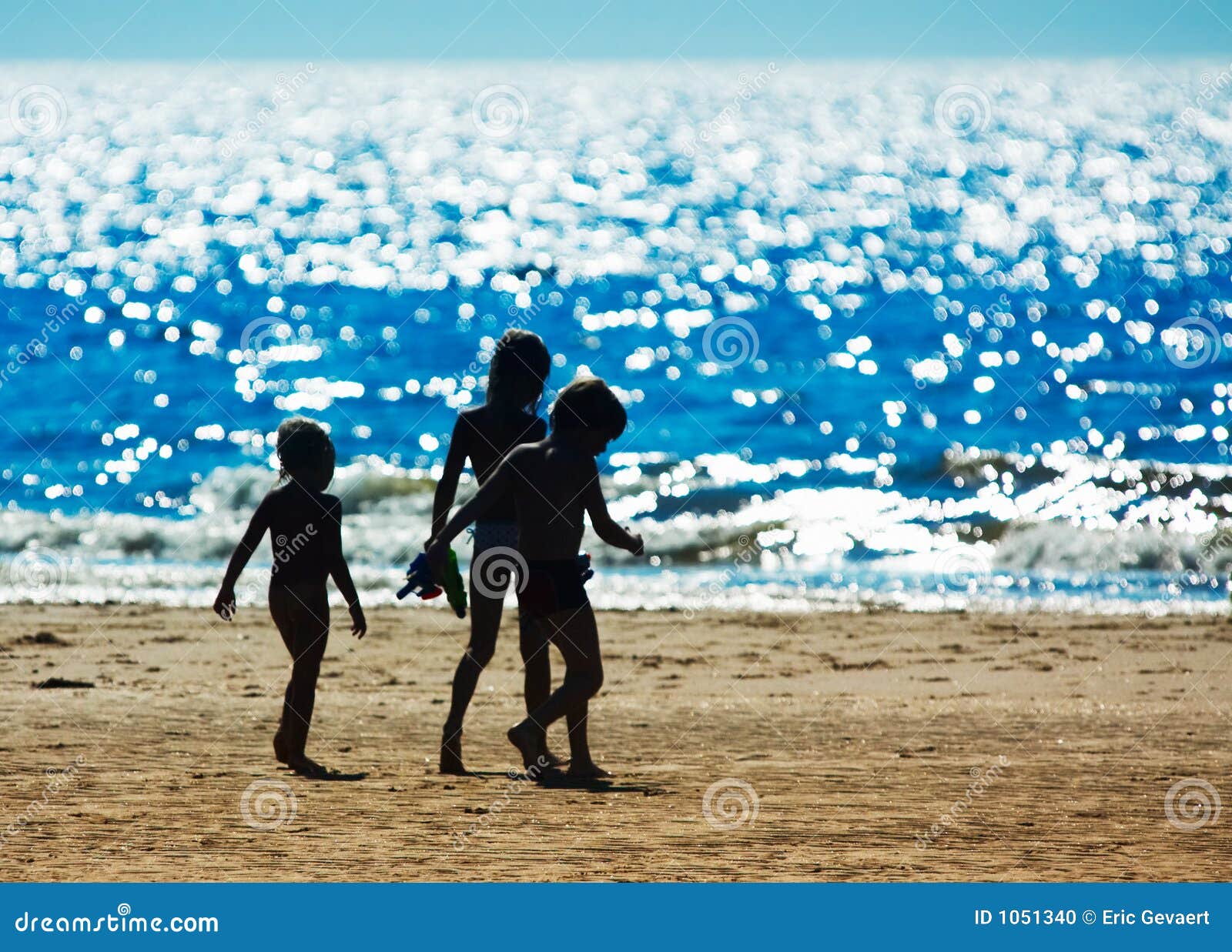Children on the beach stock photo. Image of color, family - 1051340